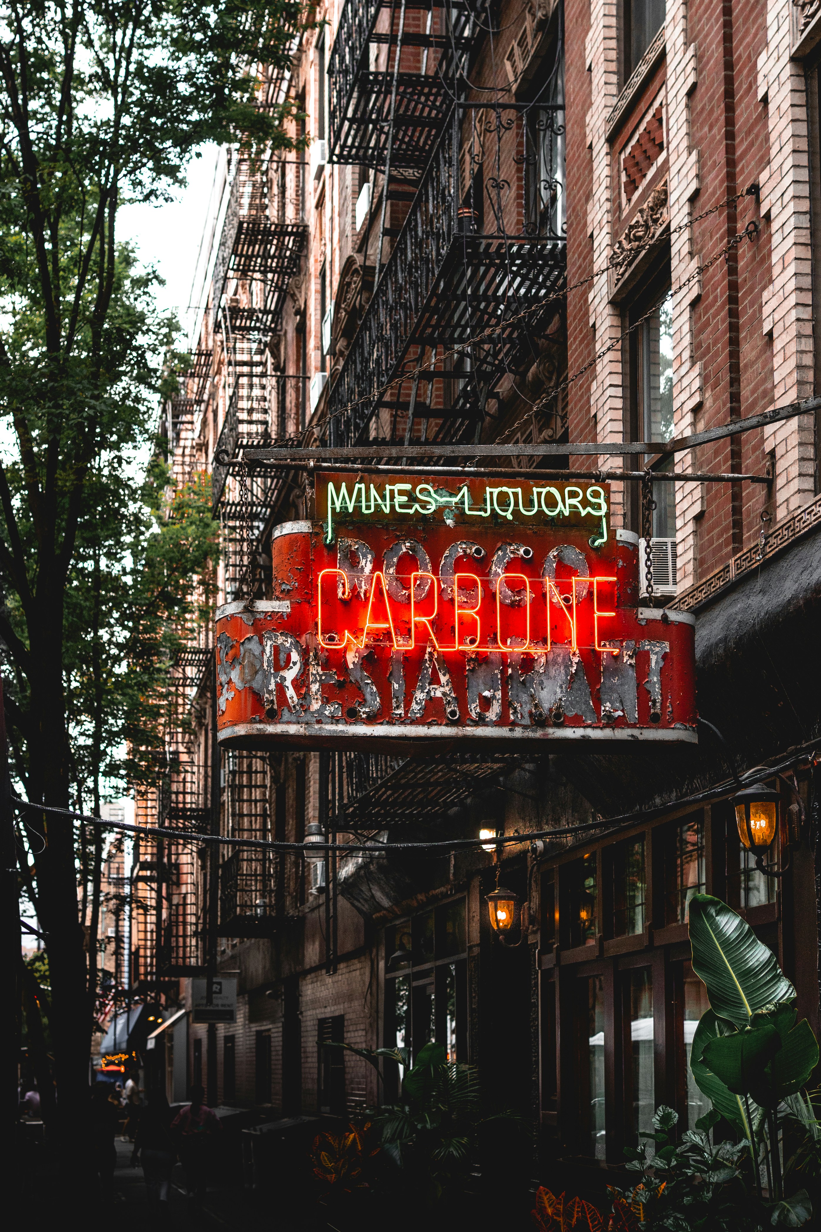 Neon Signage Over a Brick Alleyway: A Street-Level Stage