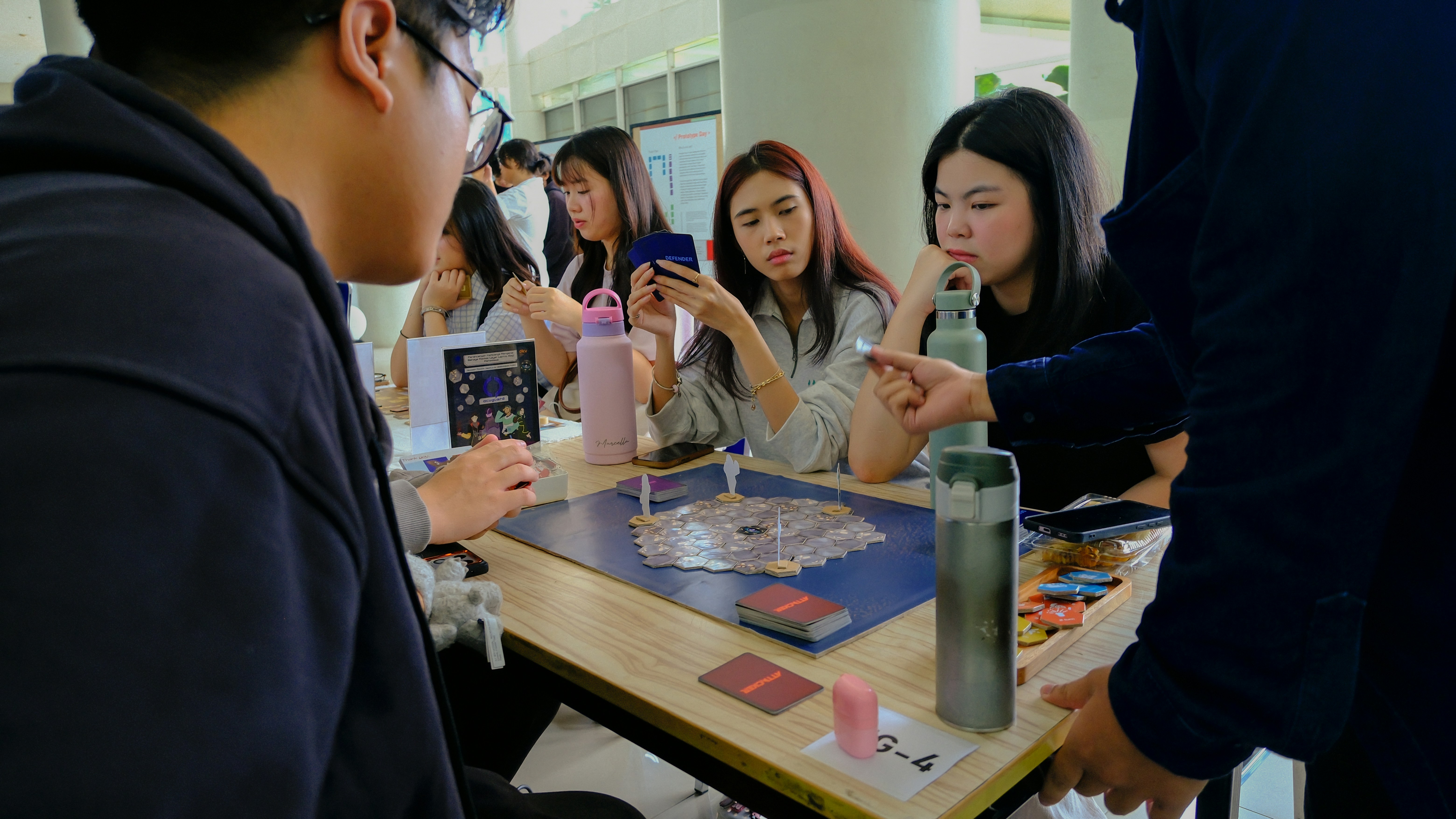 Collaboration at the Table: A Close‑Up of Hands and Screens in a Group Study Session