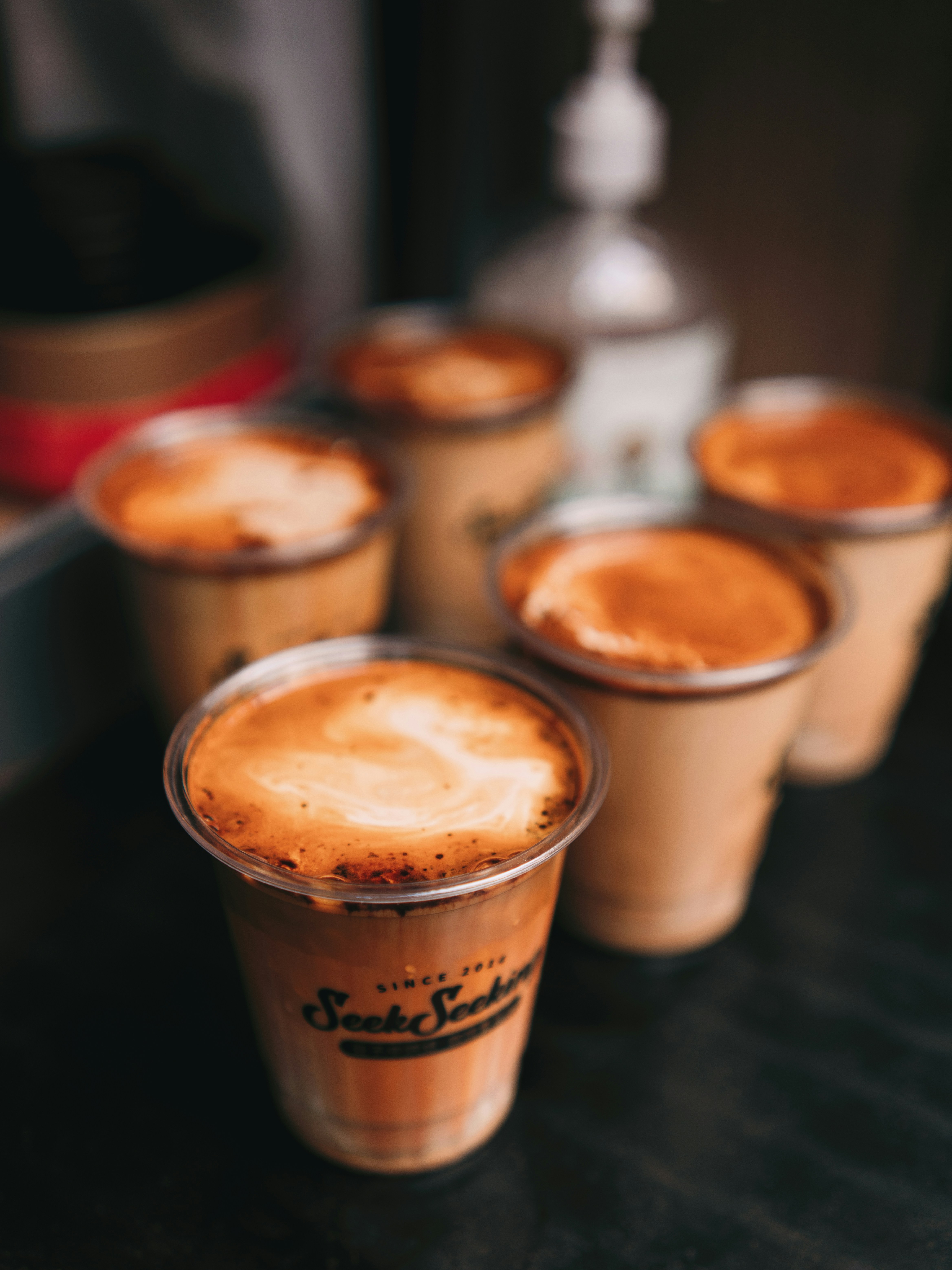 Warm Coffee Studio: A Bank of Latte Cups in Soft Focus