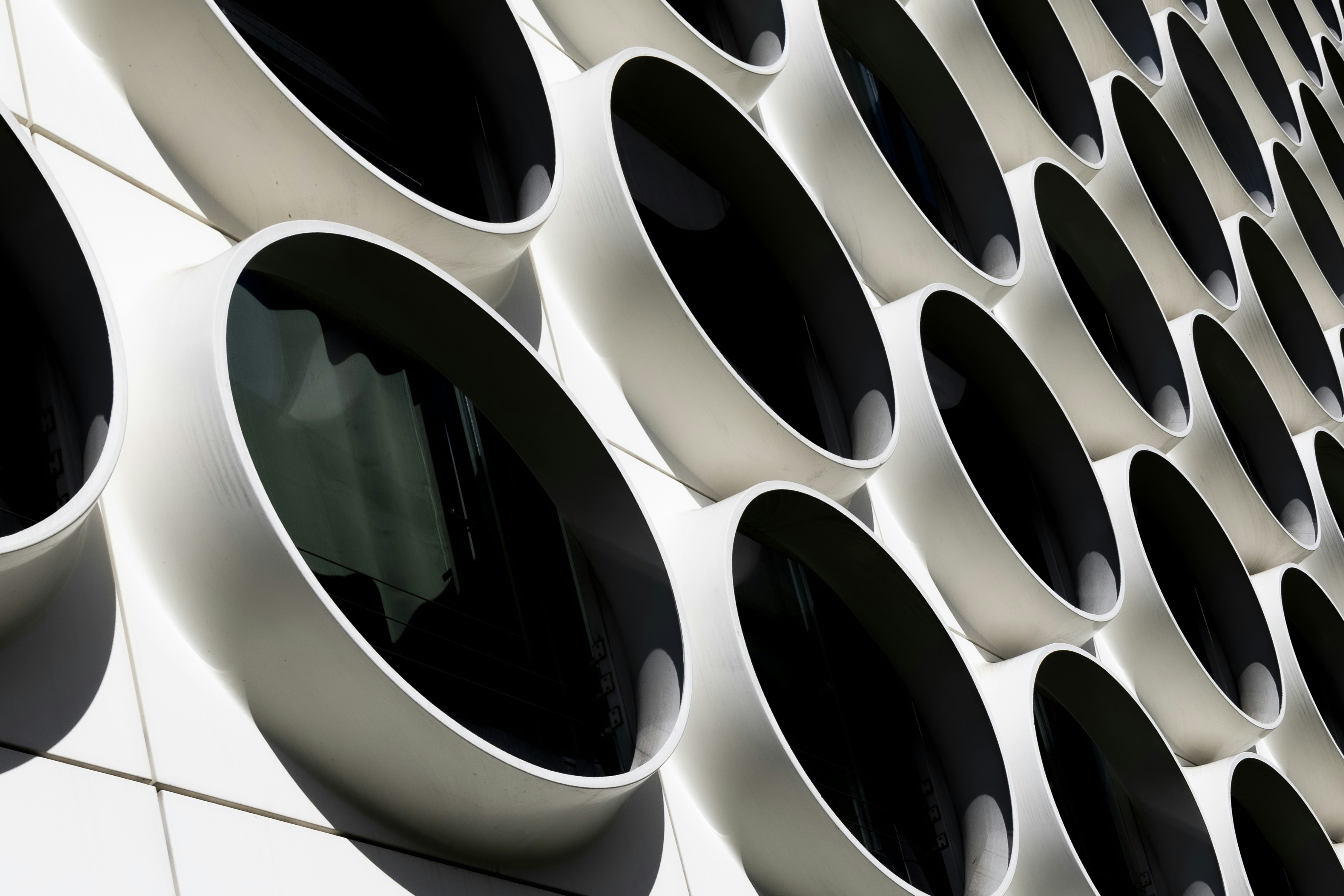 Architectural Echoes: A Grid of Circular Sun Knobs on a Facade
