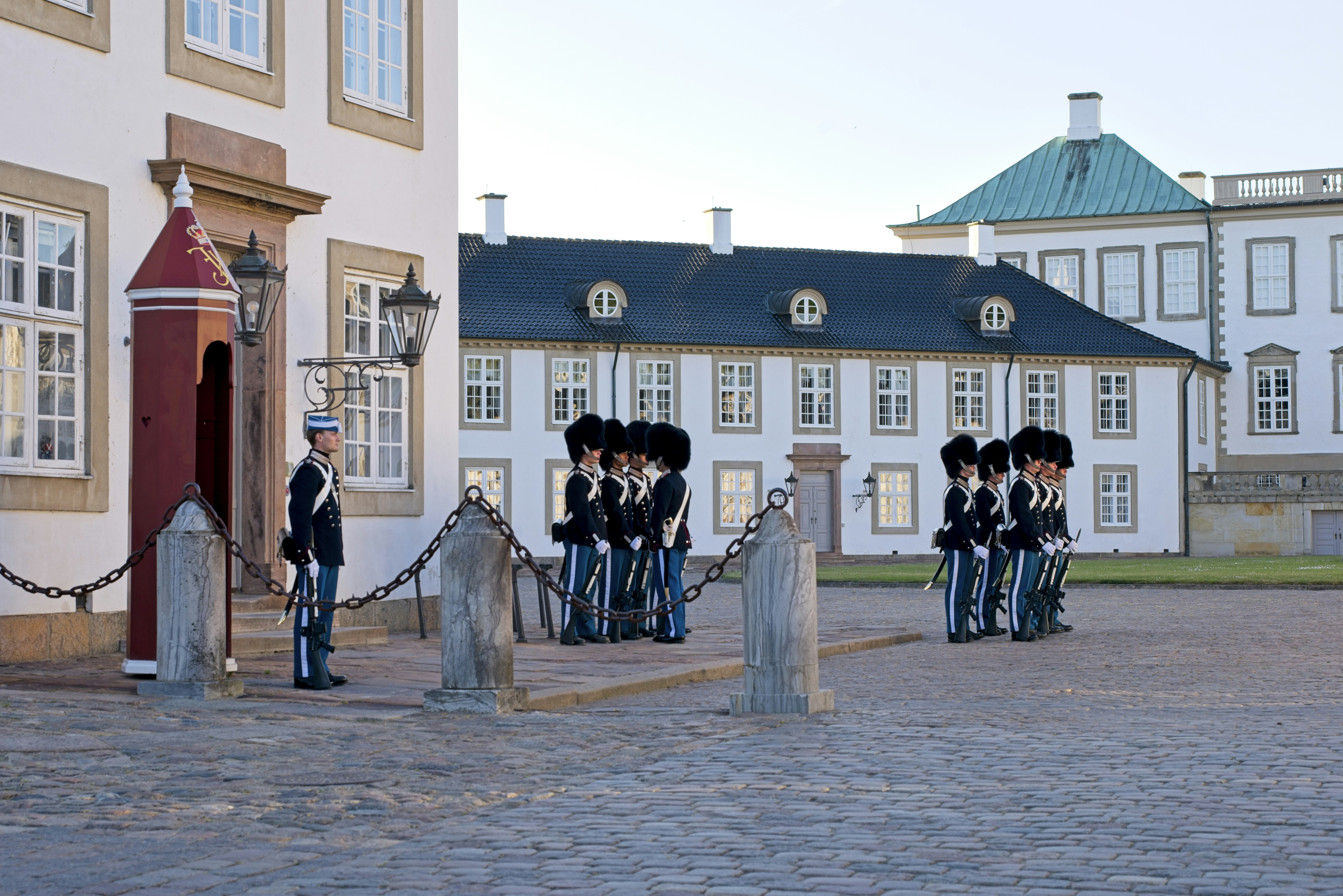 Guarded Courtyard: Soldiers in Formation at a European Estate