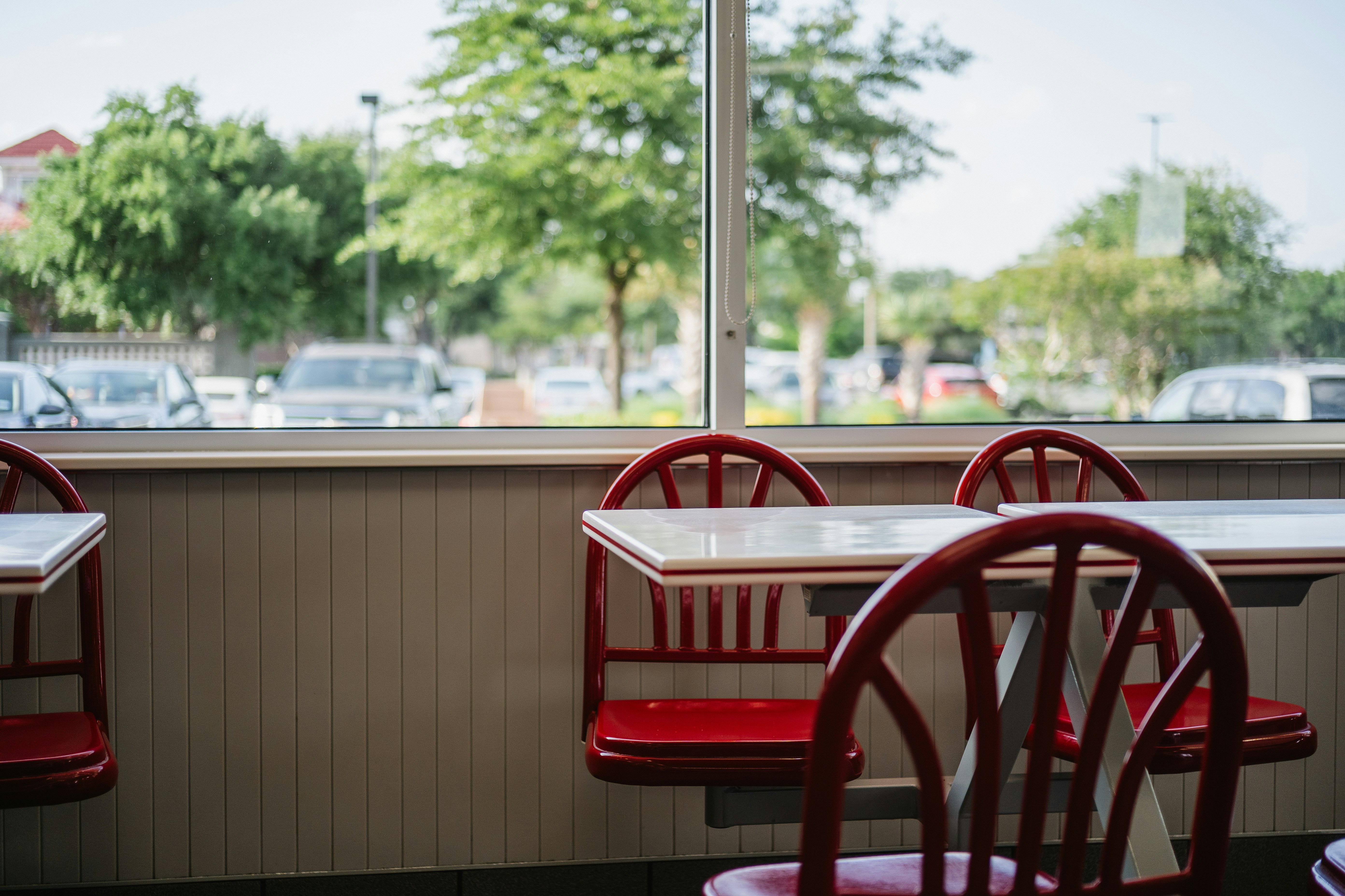 Red Chairs by the Window: Quiet Nook in Afternoon Light