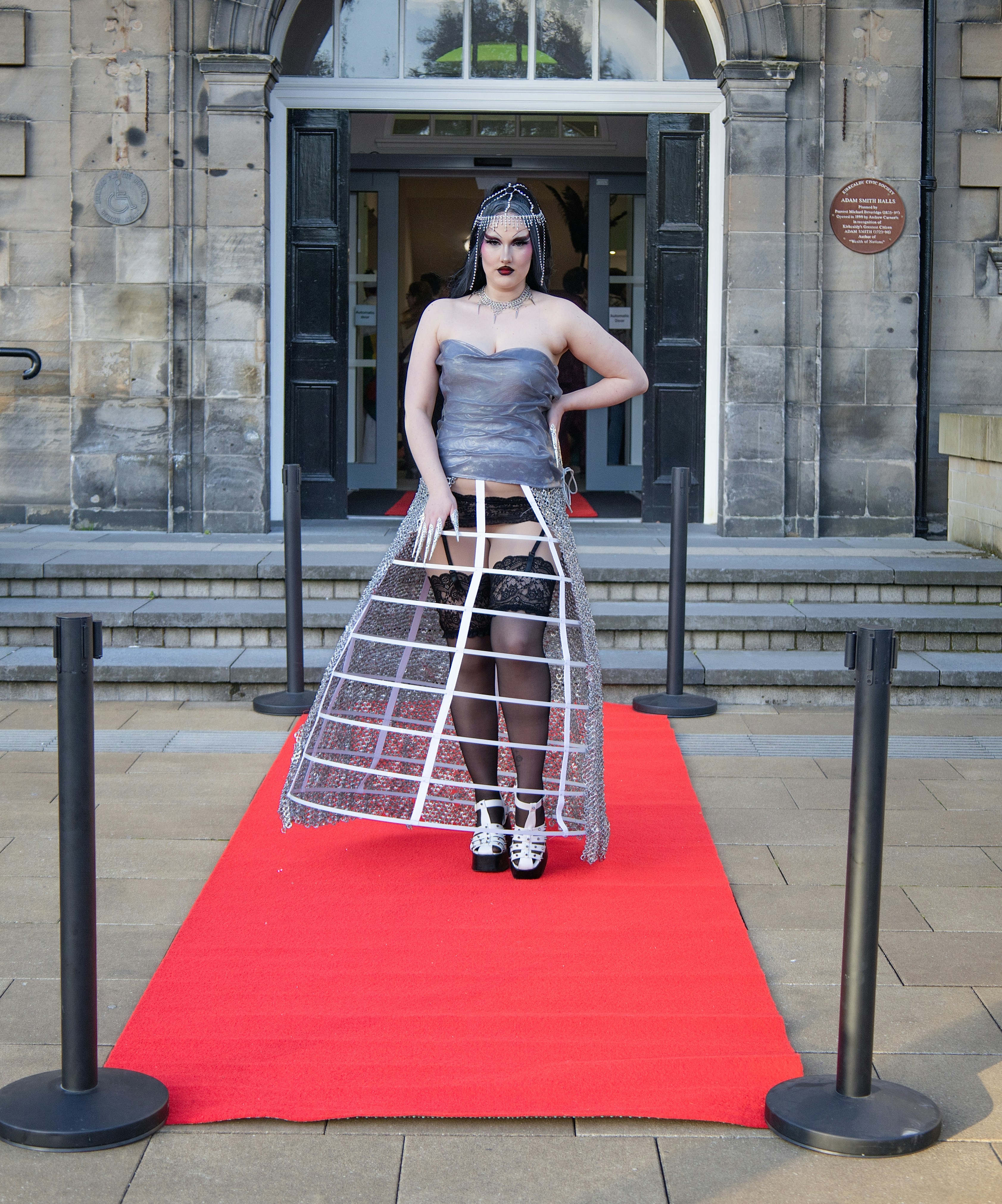 Red Carpet Rebel: A Mid-Century Muse Struts Outfront