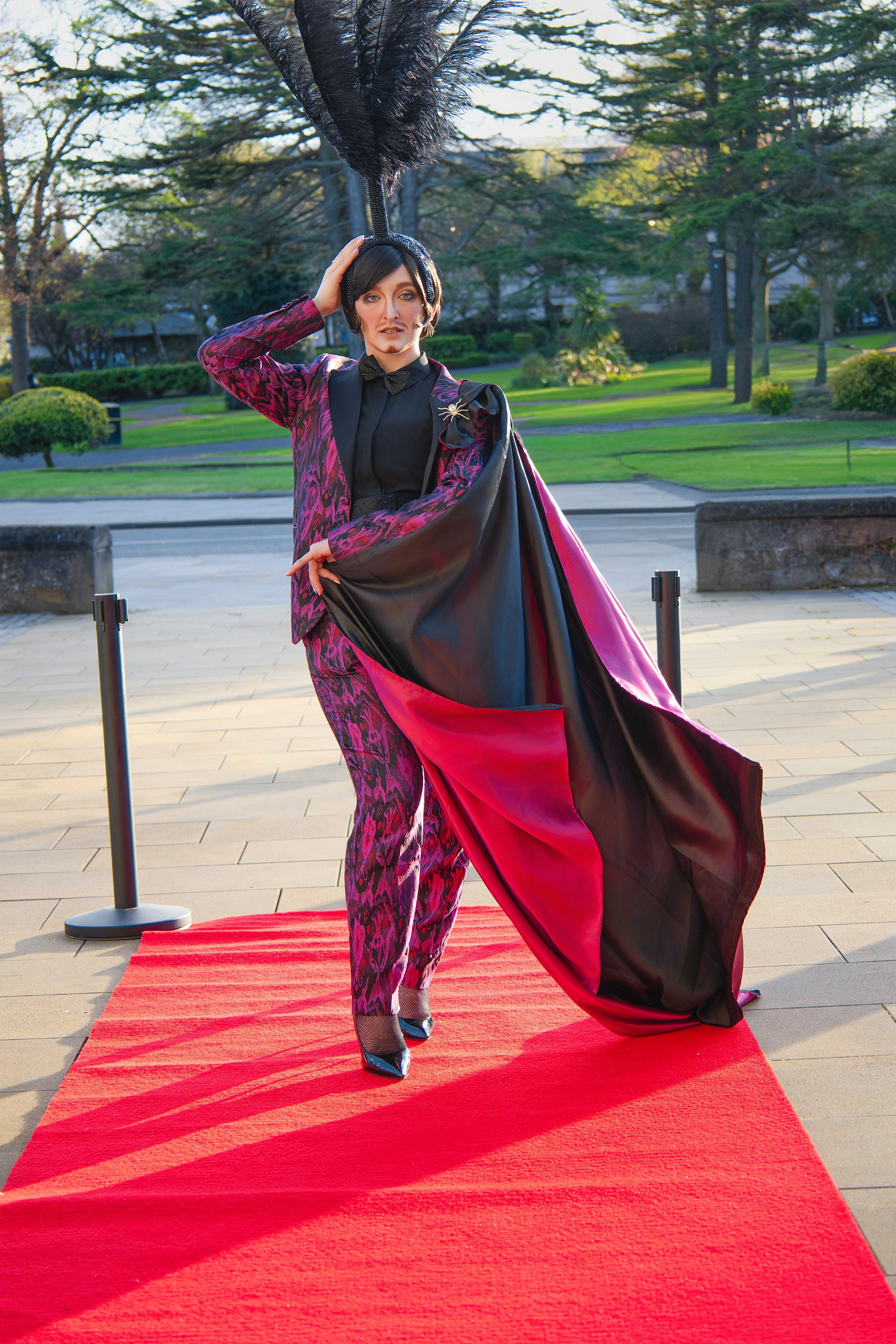 Crimson Velvet on a Red Carpet: A Dramatic Fashion Moment in the Park