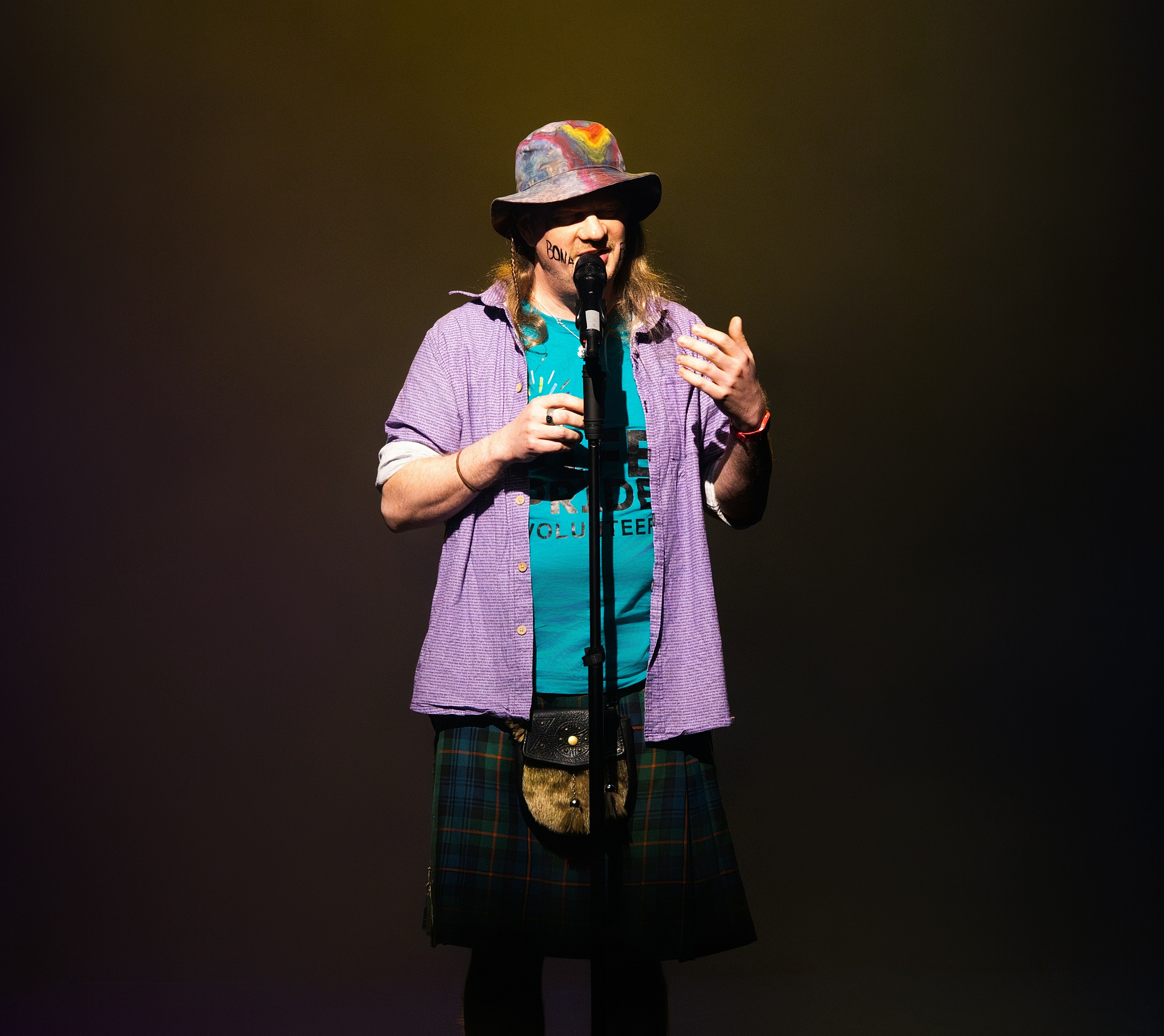 Harmonica of Colors: A Street-Style Performer Under Stage Light