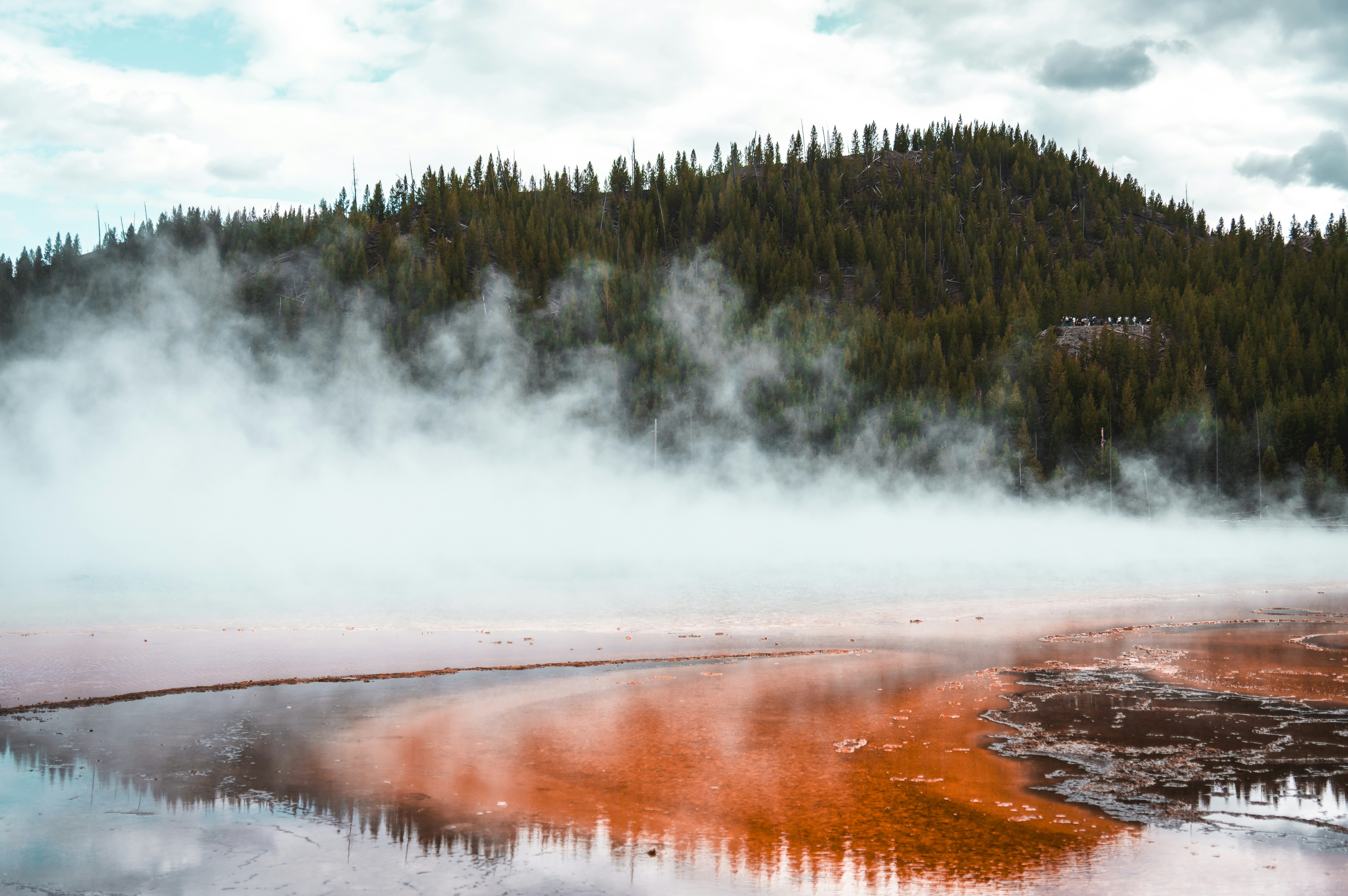 Ridge of Steam and Fire Over a Mirror Lake