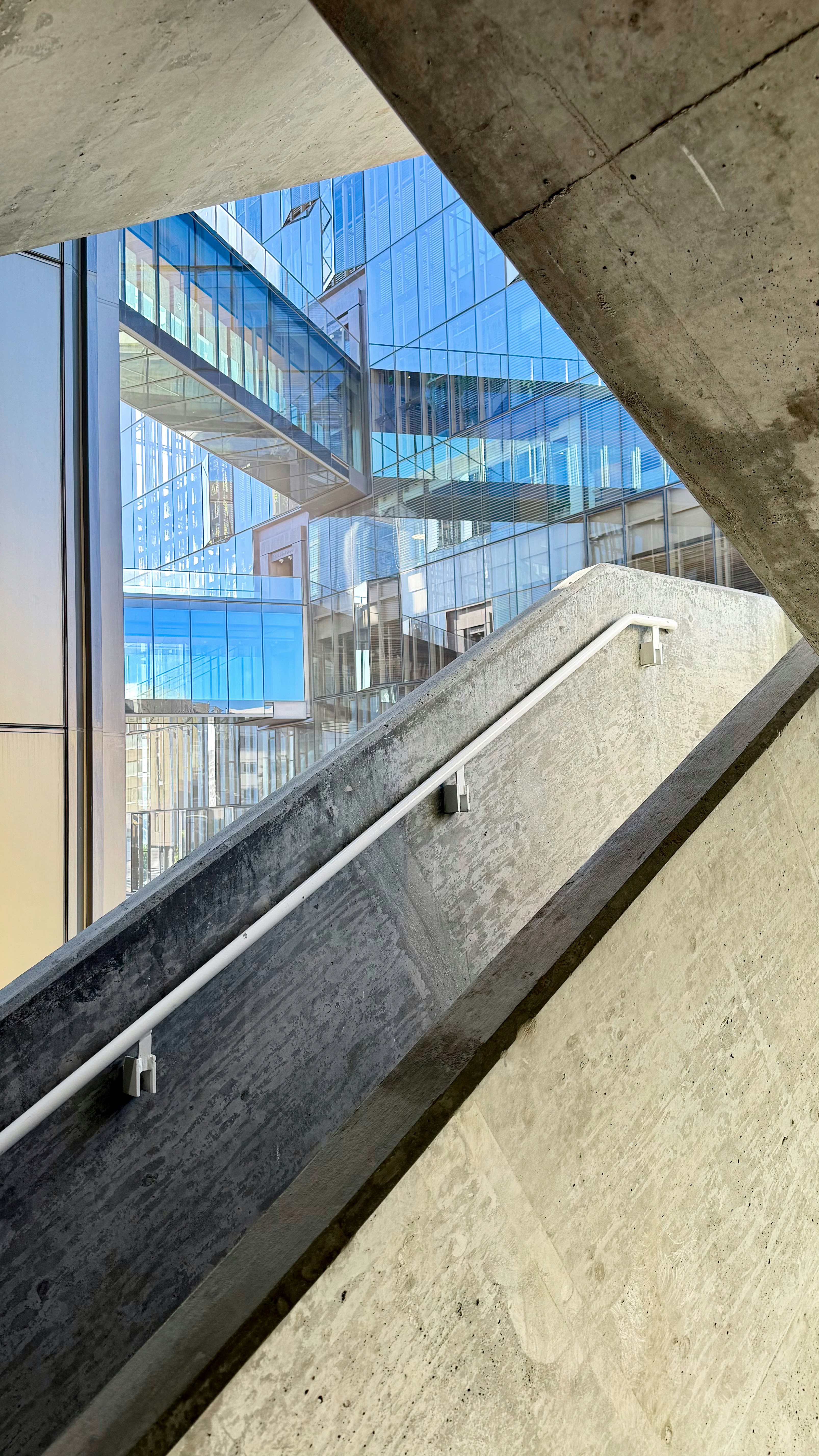 Blue Glass Fragments Through Concrete Angles