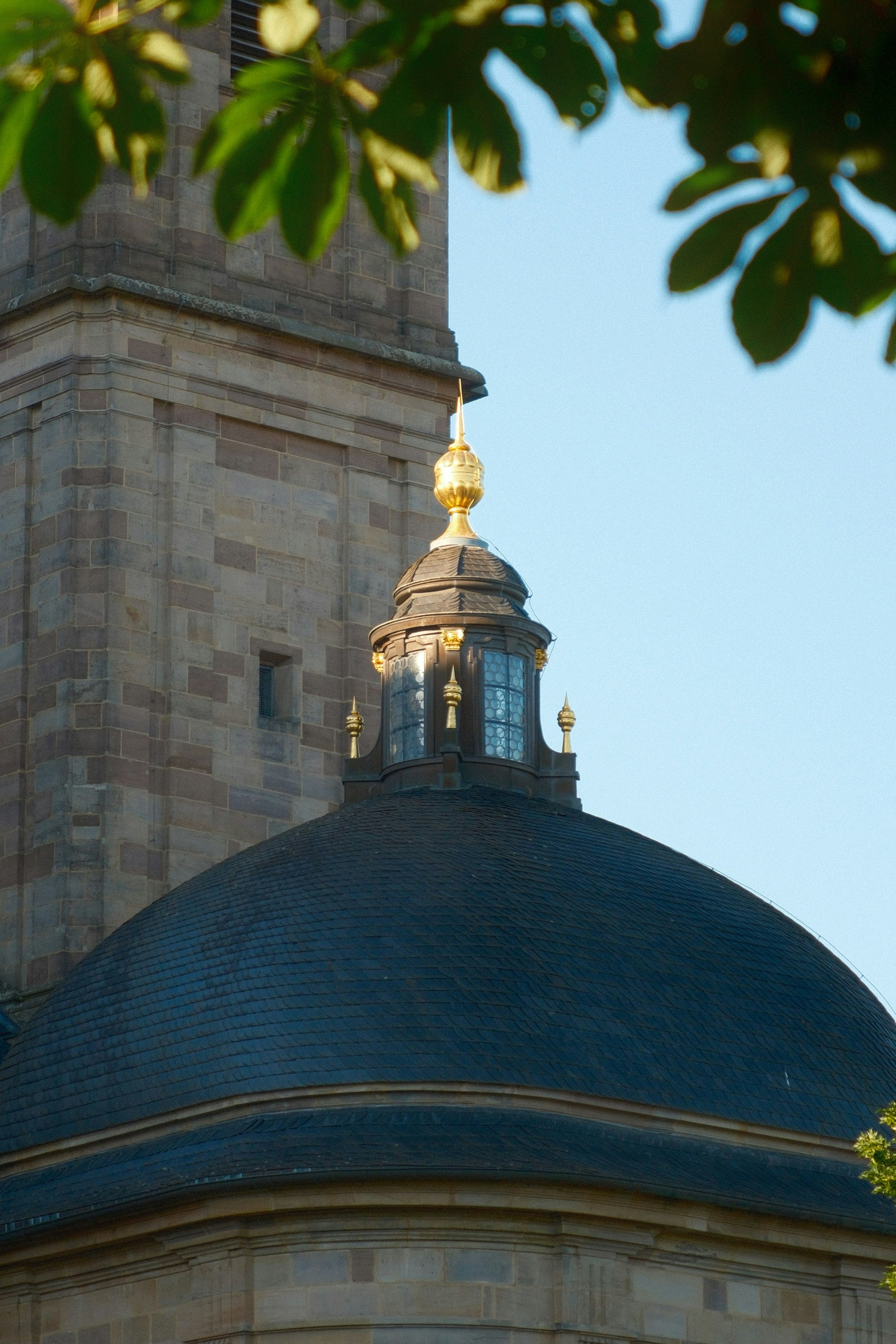 Golden Finial Above Domed Roof at Dappled Frame