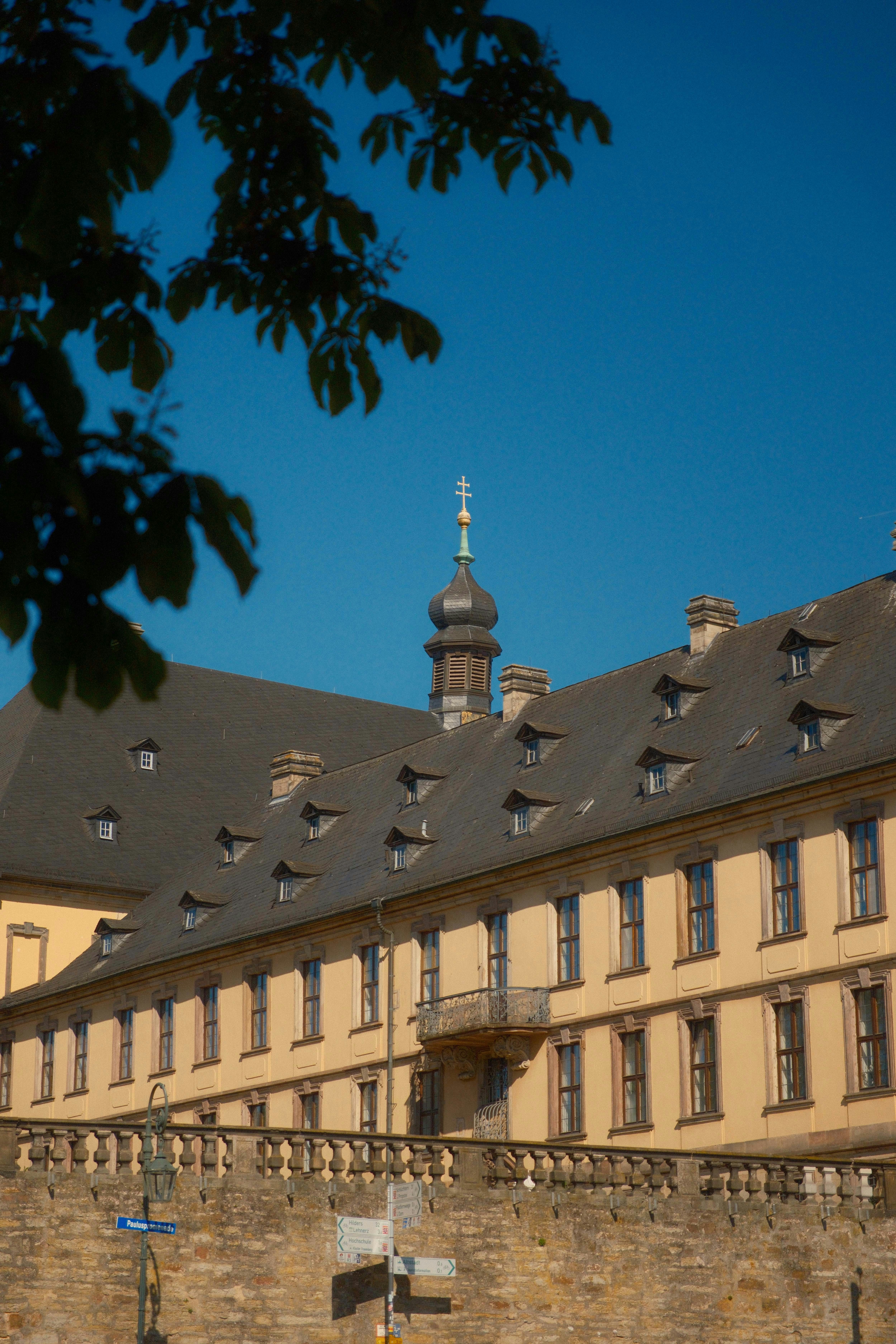 Historic Courtyard Facade under a Clear Cadet Sky