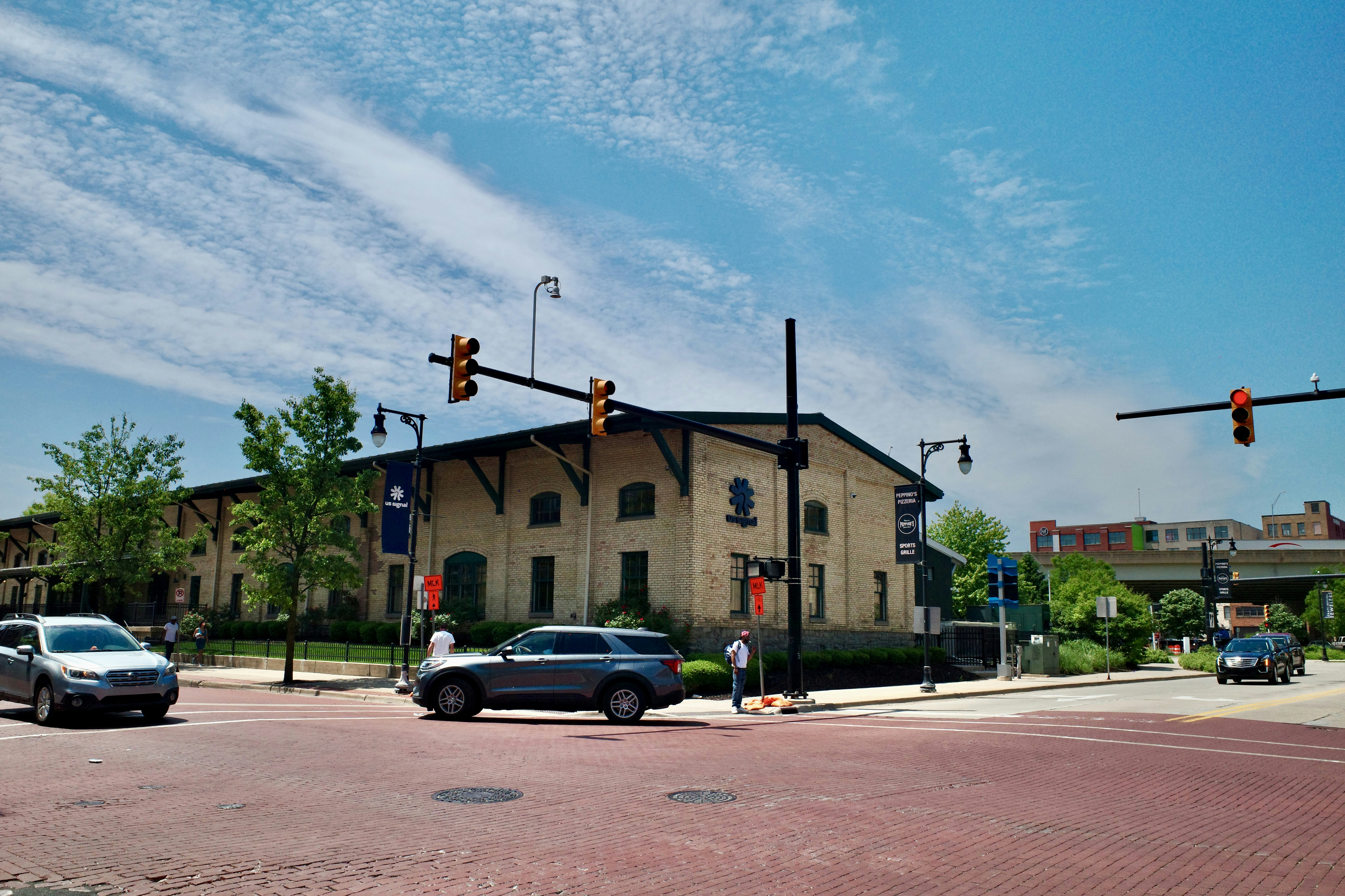 Crossroads City Hall: Brick Facade Under a Bright Sky