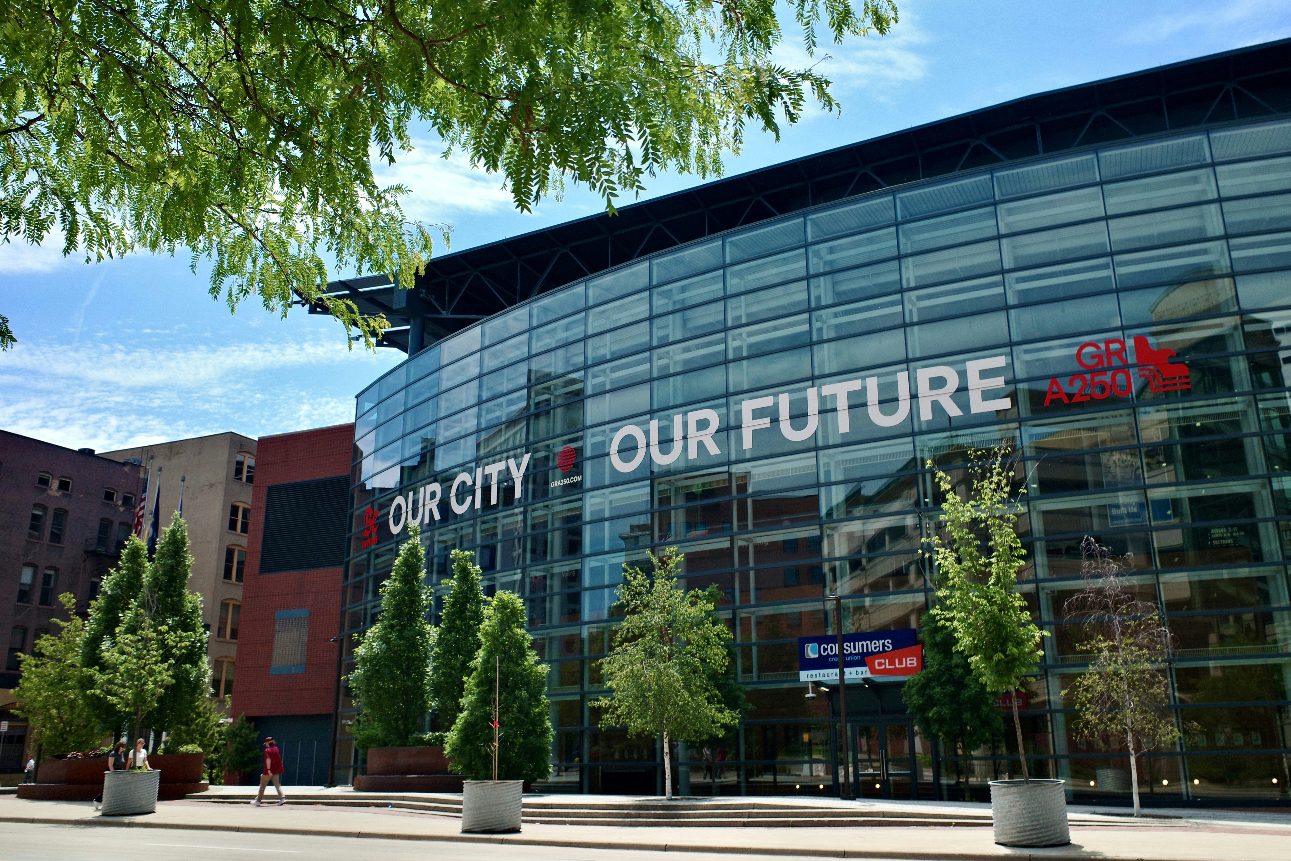 Glass Facade, Greenery, and the City Sign: A Modern Civic Portal