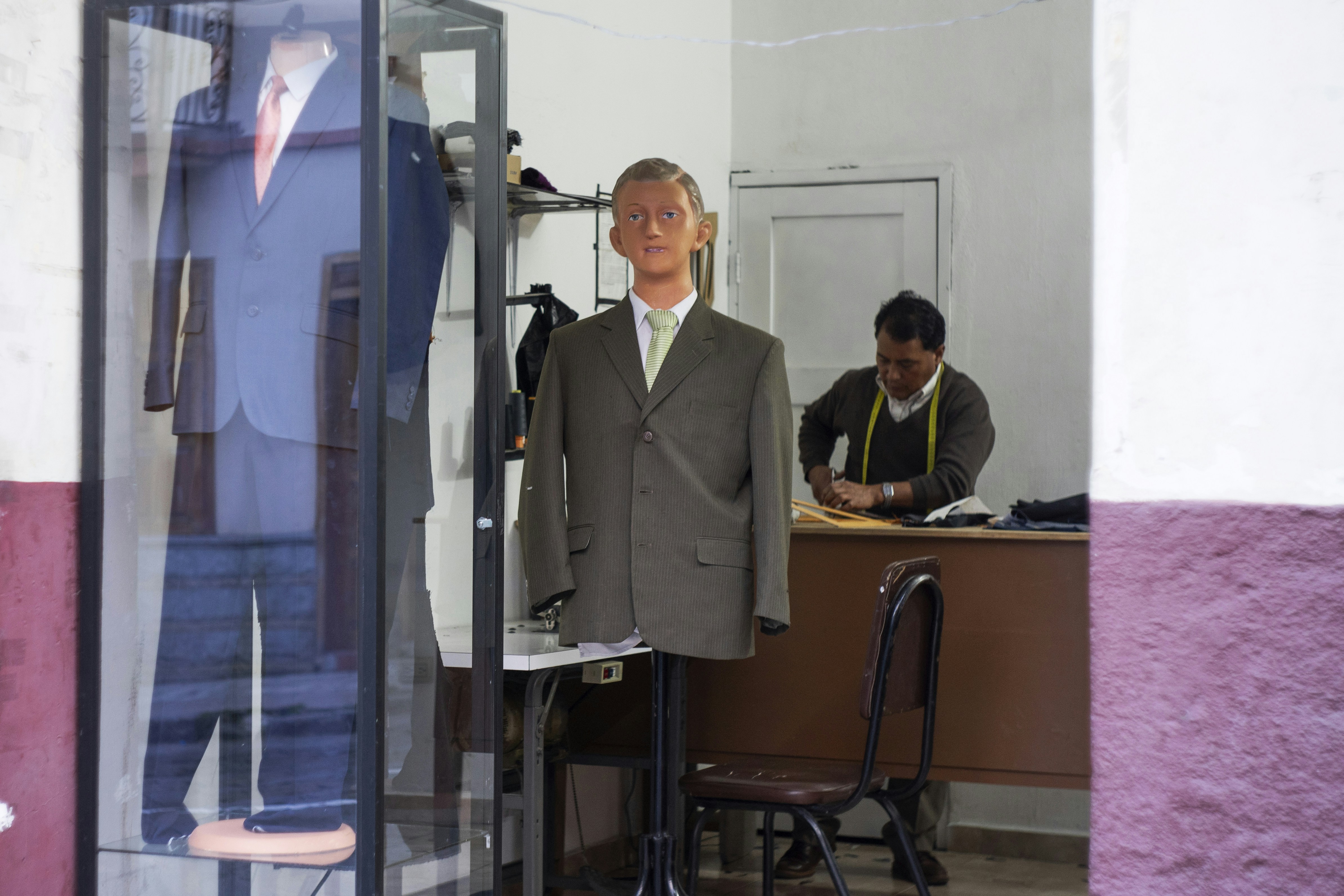 Rigid Mannequin in a Tailor Shop Window