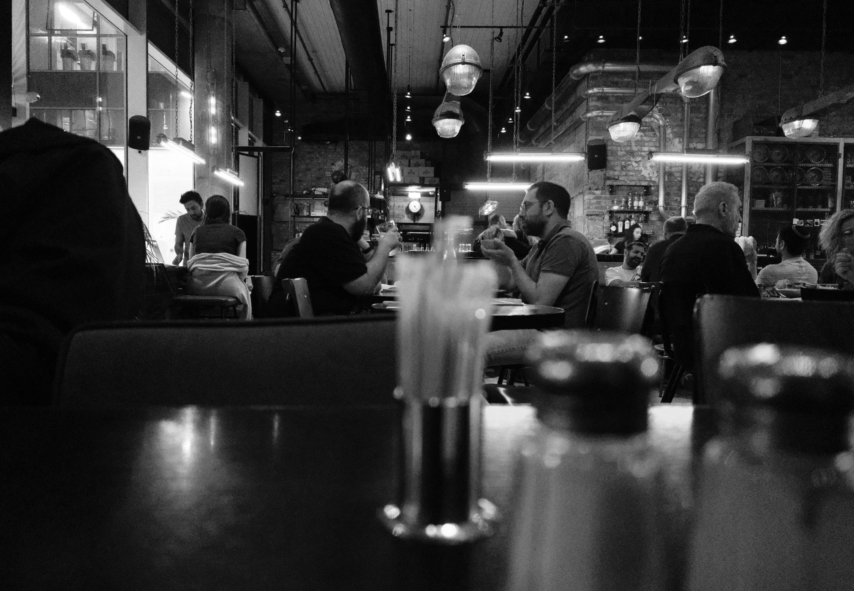 Midnight Conversations Across a Neon-Lit Café