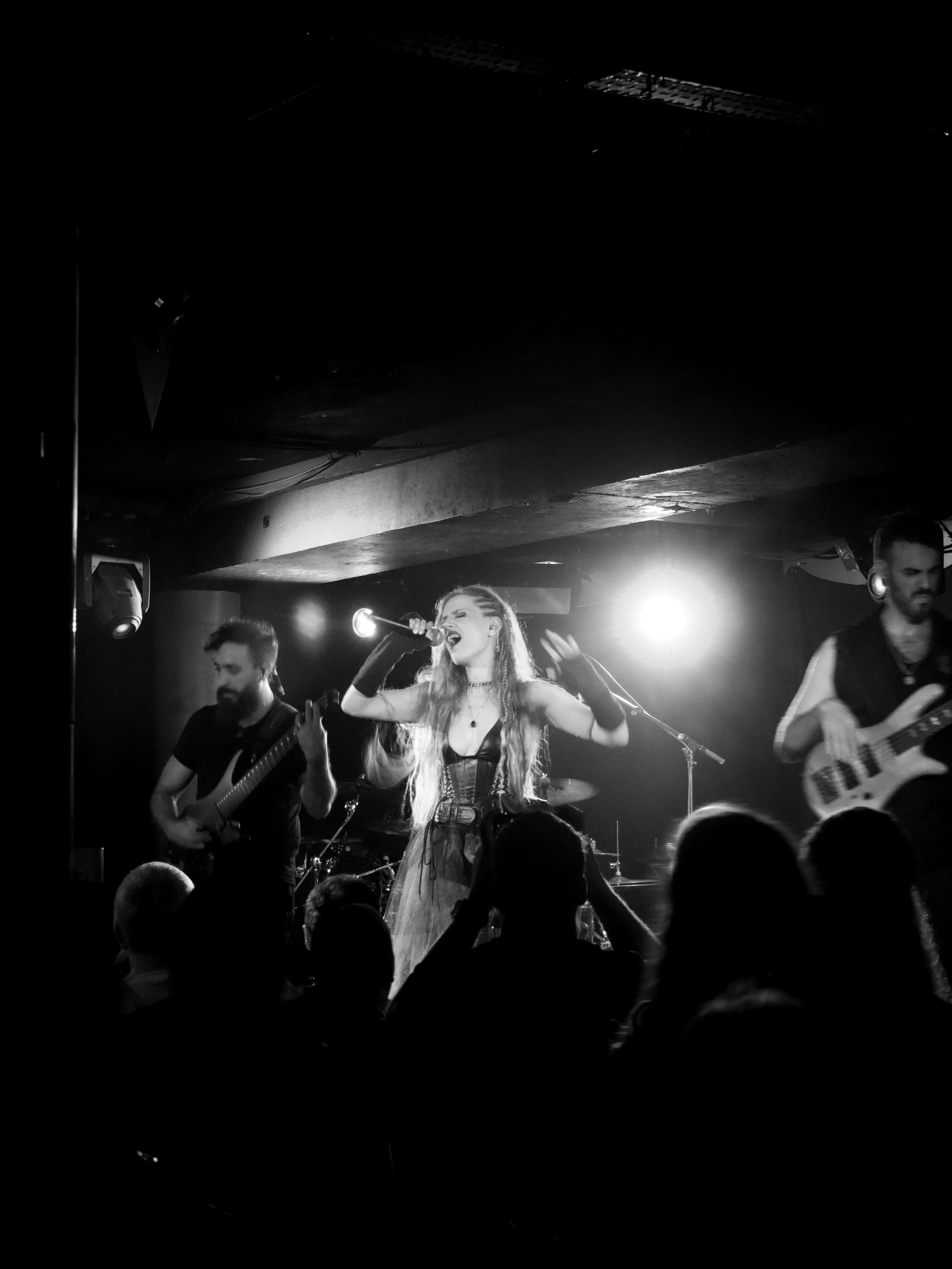 Midnight Echoes: A Vocalist Anchoring the Stage
