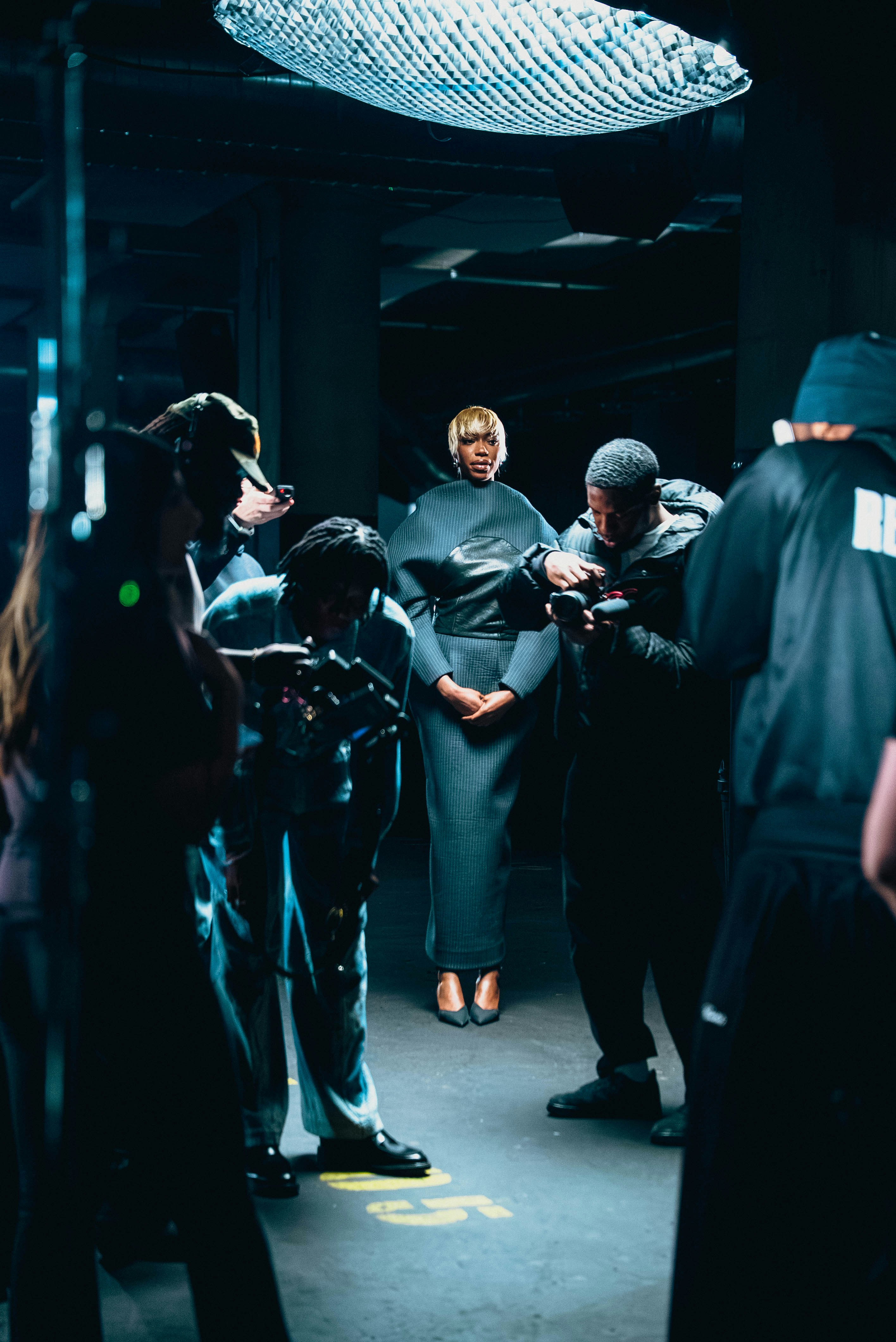 Center Stage: The Dignified Gown Amid the Backstage Pulse