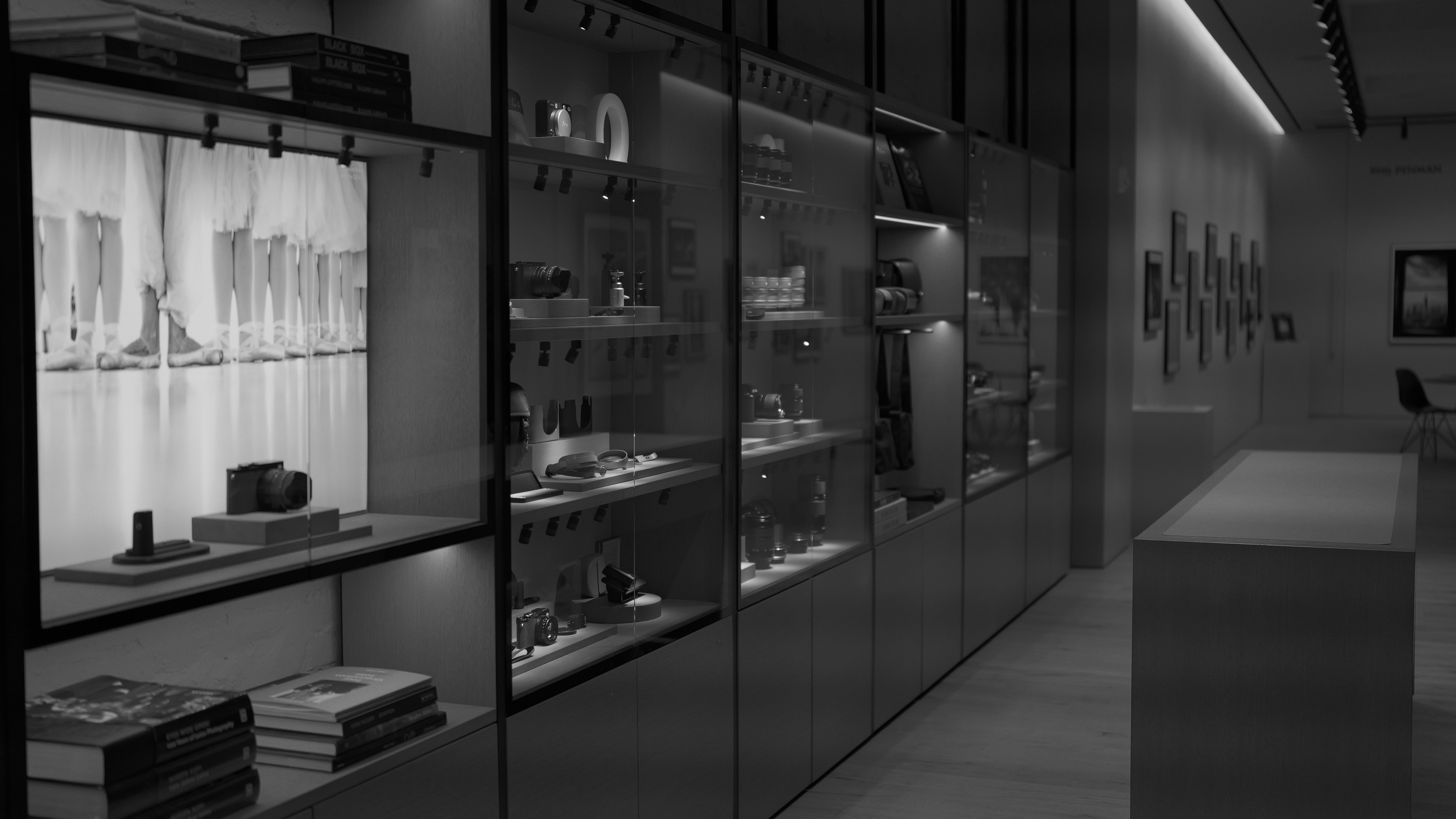 Silent showroom: glass cabinets mirror a monochrome gallery of time