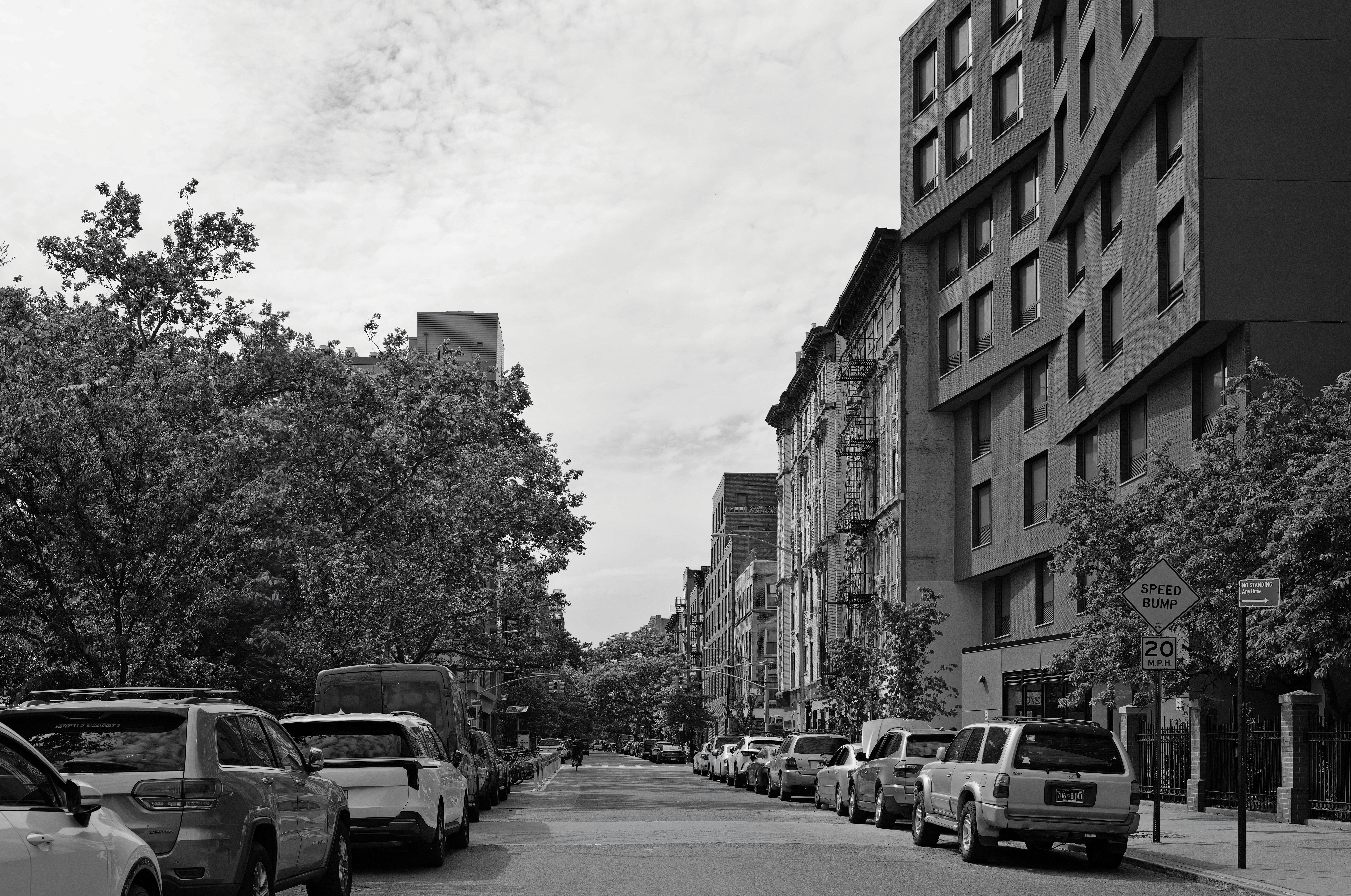 Urban Monochrome: Street Corridor Toward the Distant Skyline