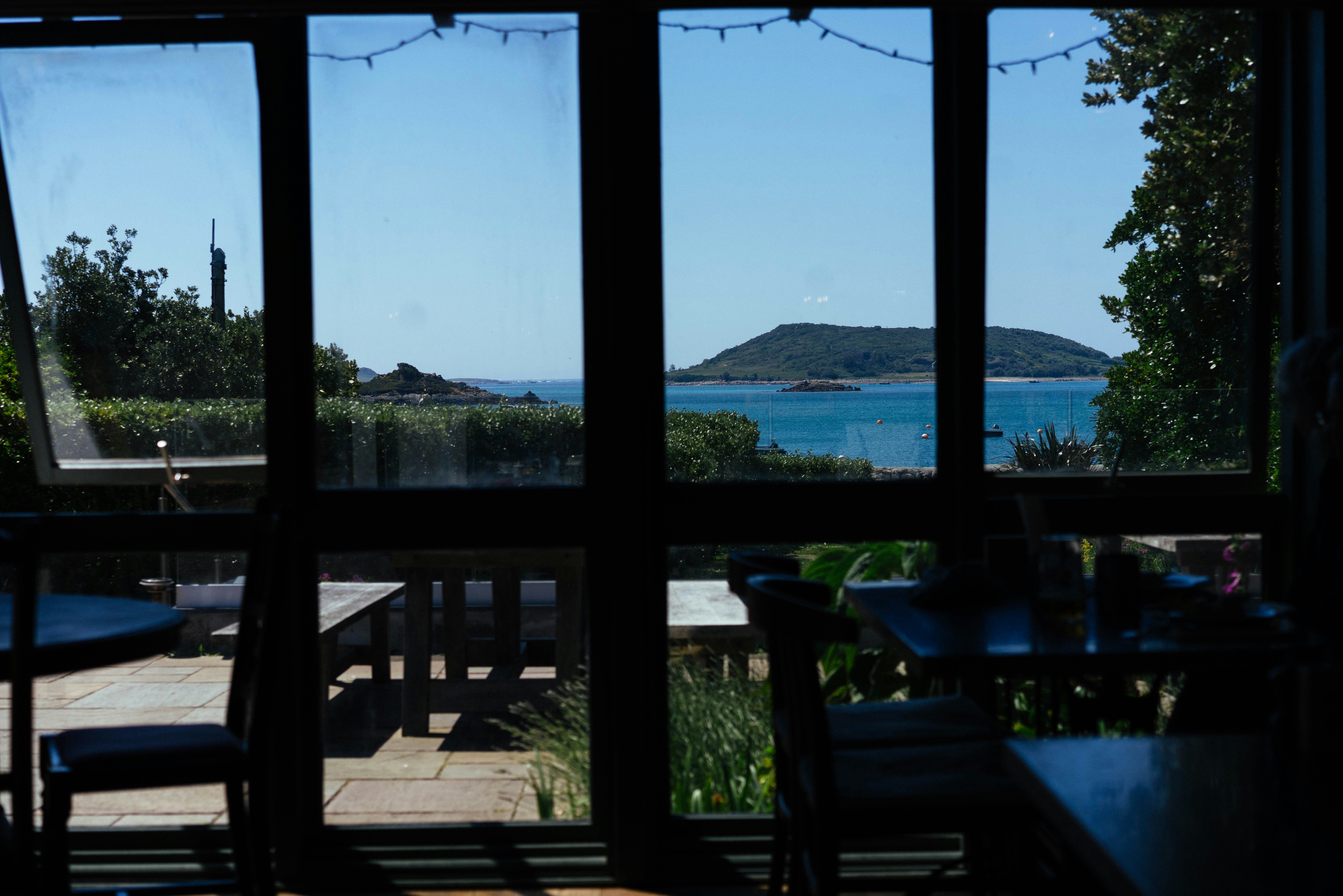 Coastal View Through a Dim Interior