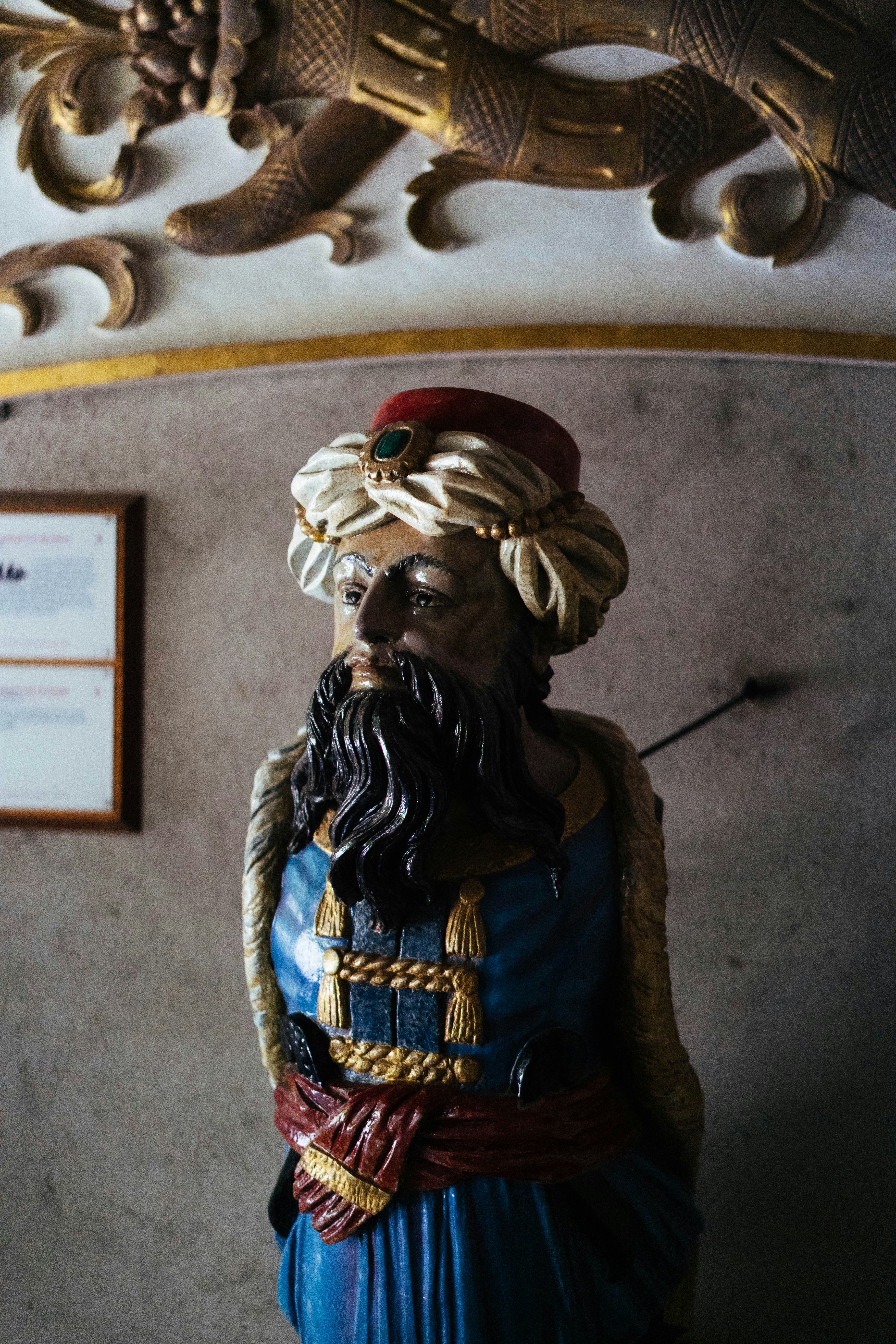 Statue of a Turbaned Hero Guarding an Ornate Border