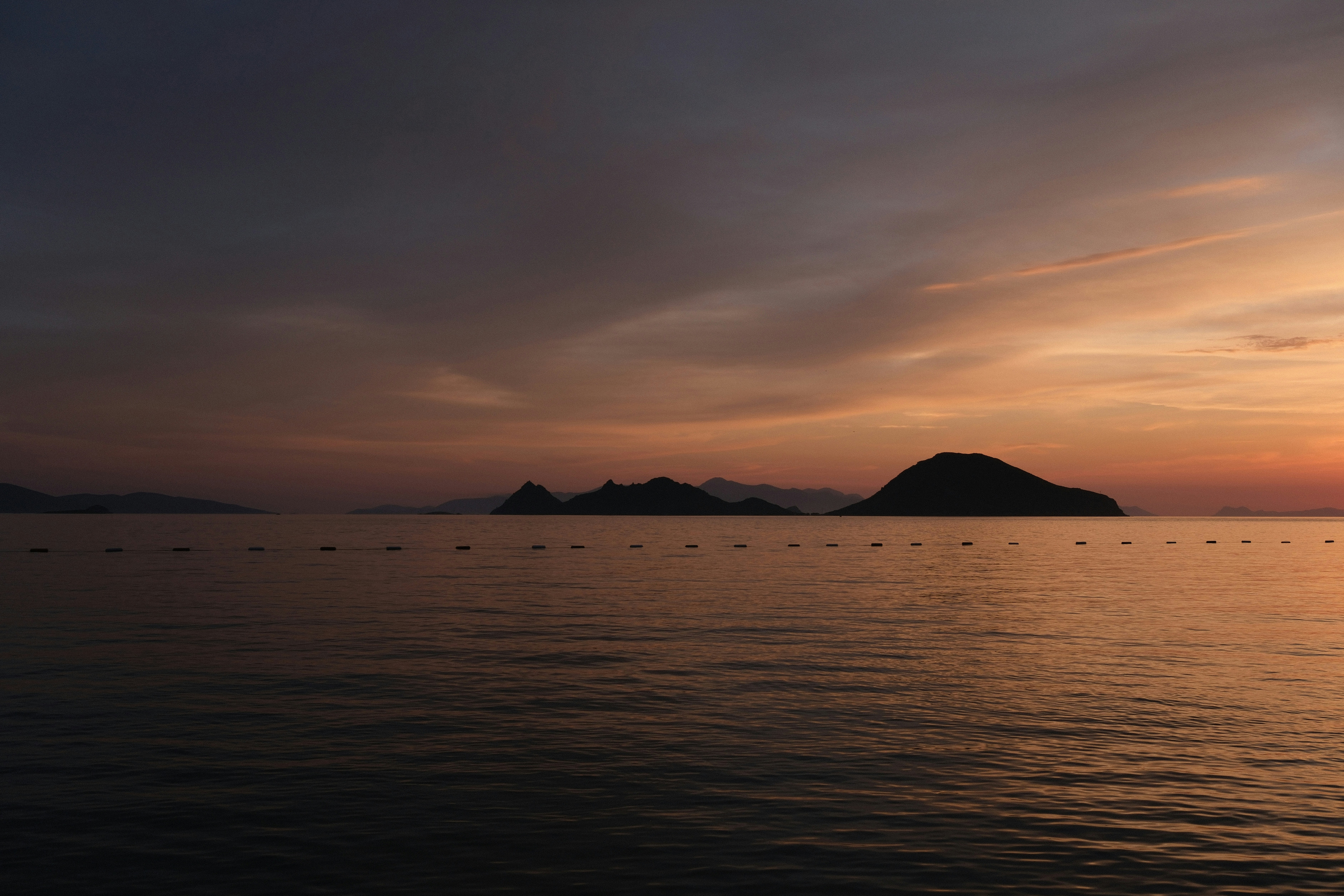 Dawn over Quiet Islands: A Velvet SeaSundown