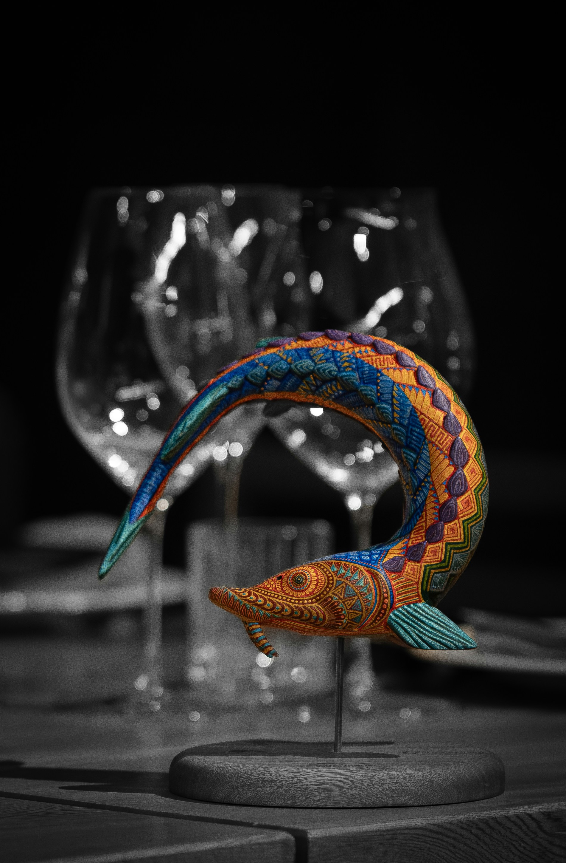 Colorful Serpent Sculpture Emerges from a Quiet Dinner Setting