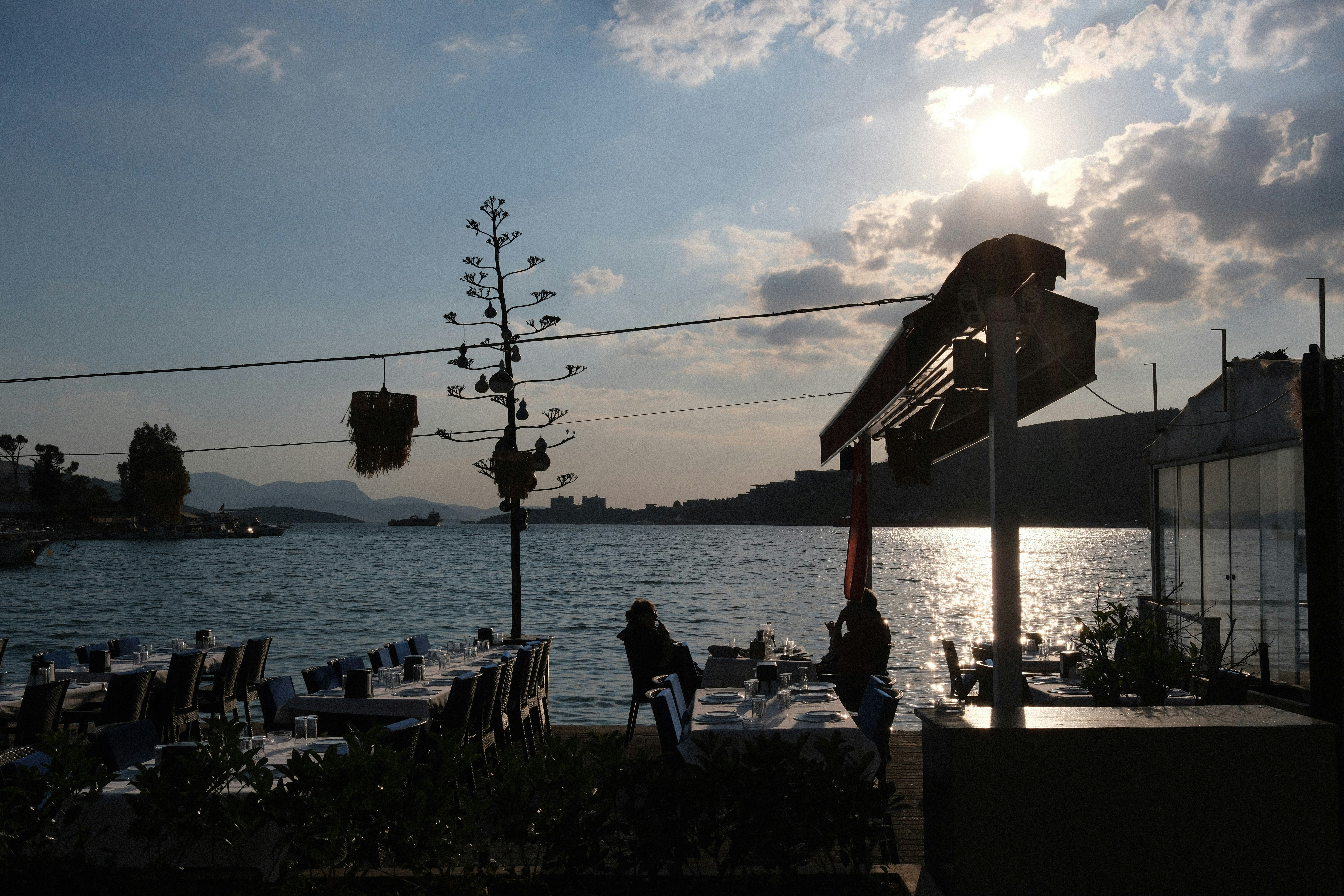 Sunlit Harbour Café at Dusk