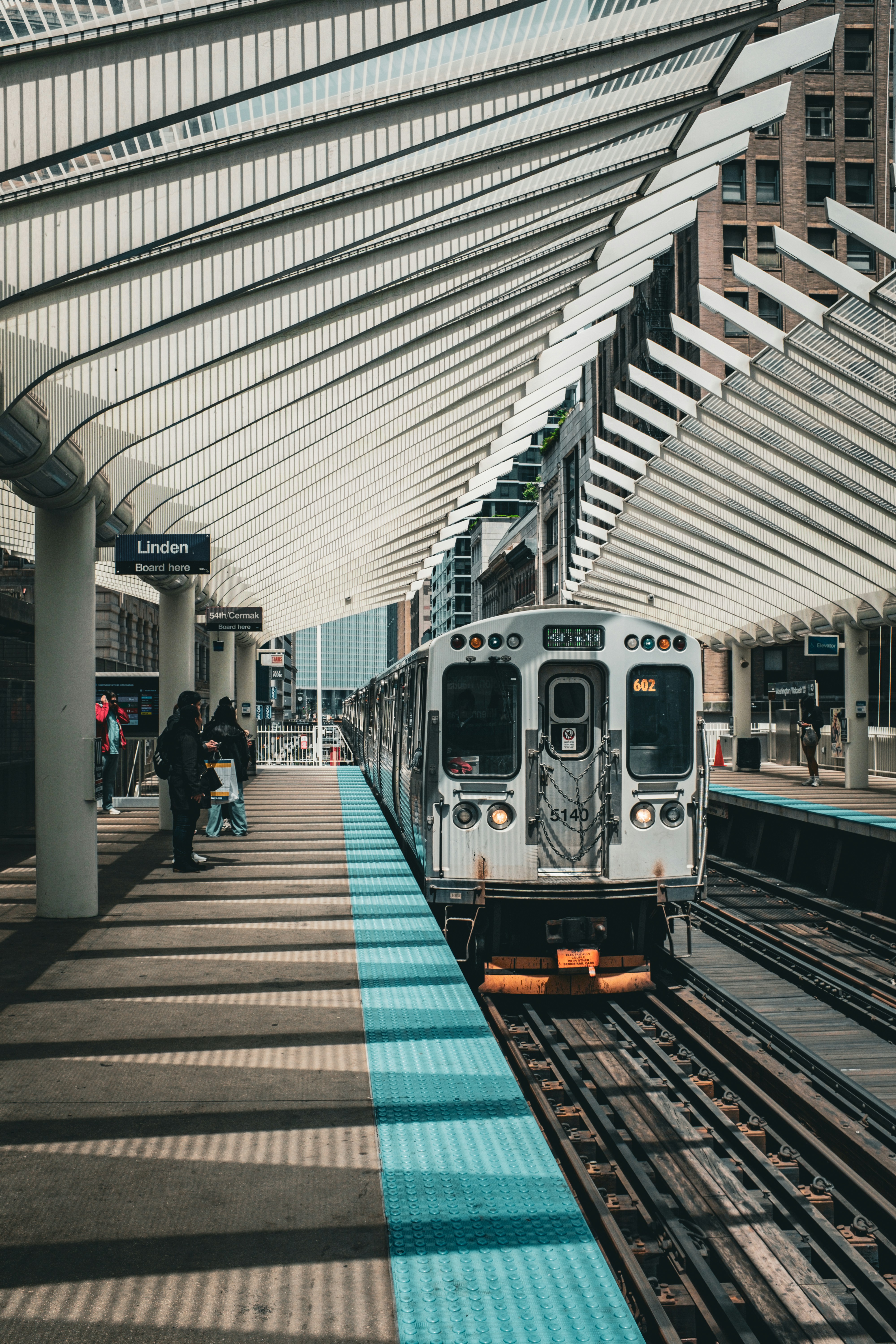 Platform Pulse: A Metro Train Slides into the Blues of the Blue Line