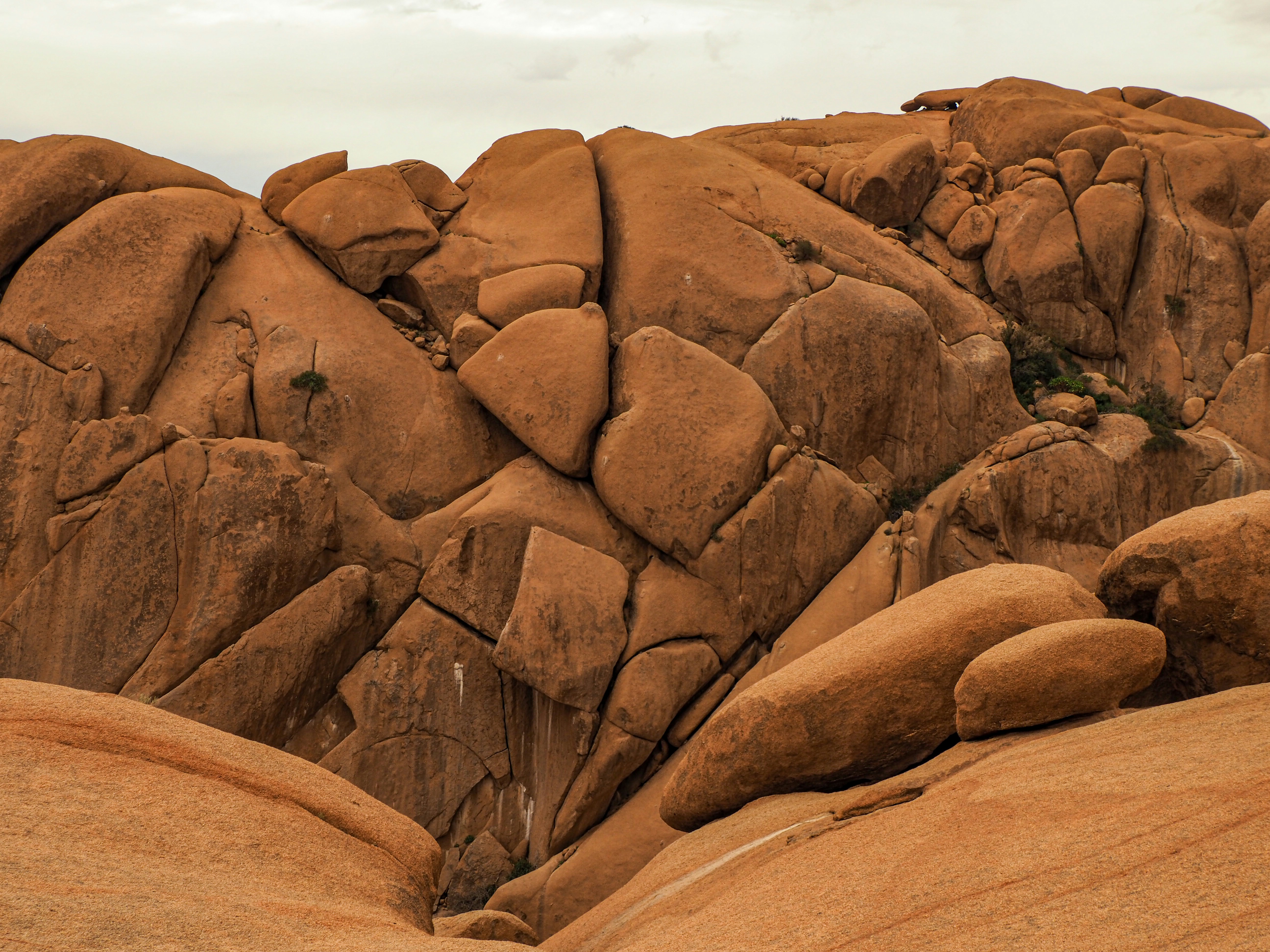 Pebbled Monoliths: A Quiet Orange Panorama