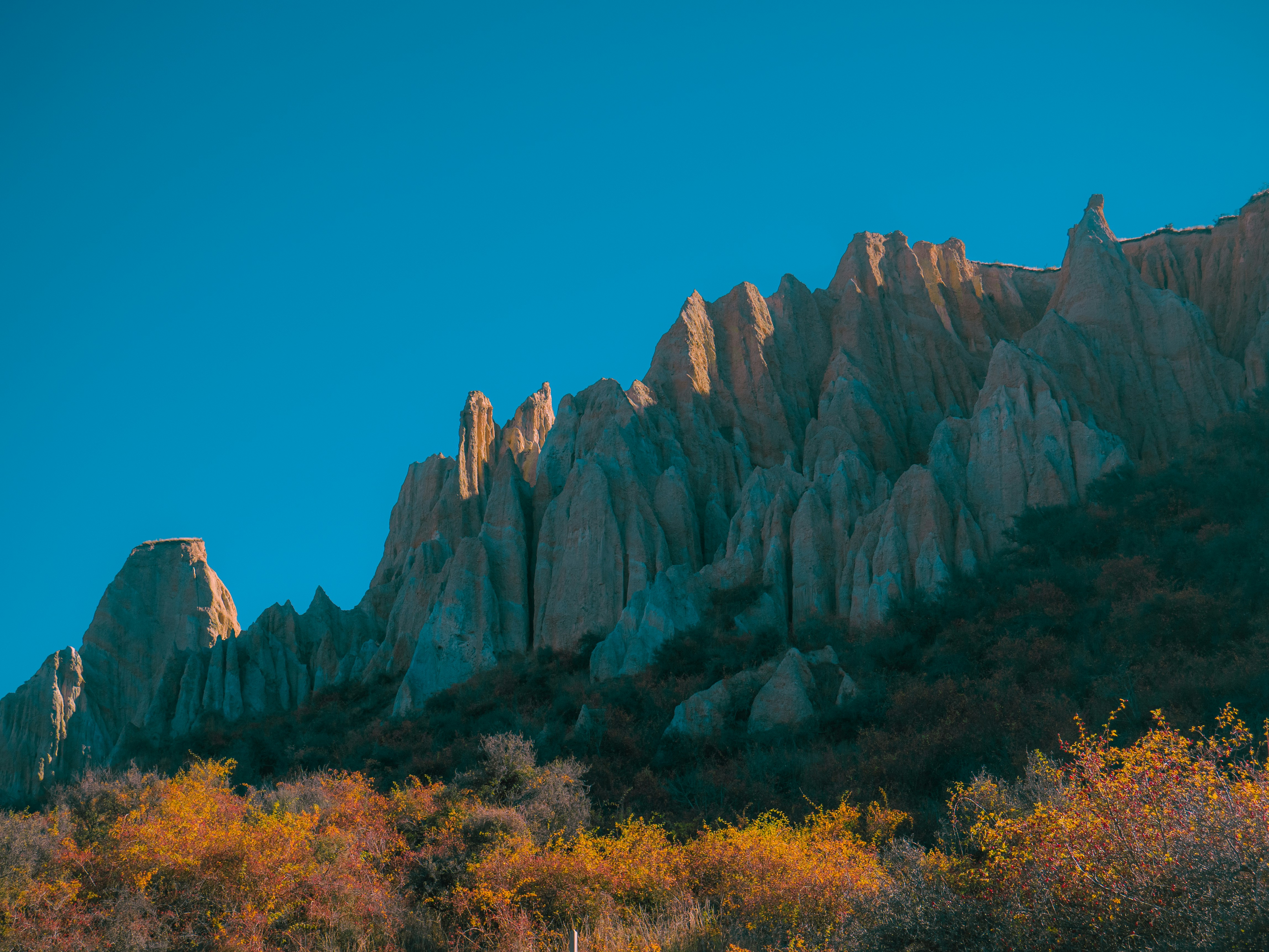 Sunlit Ridge: Cliffs Against a Clear Blue Sky