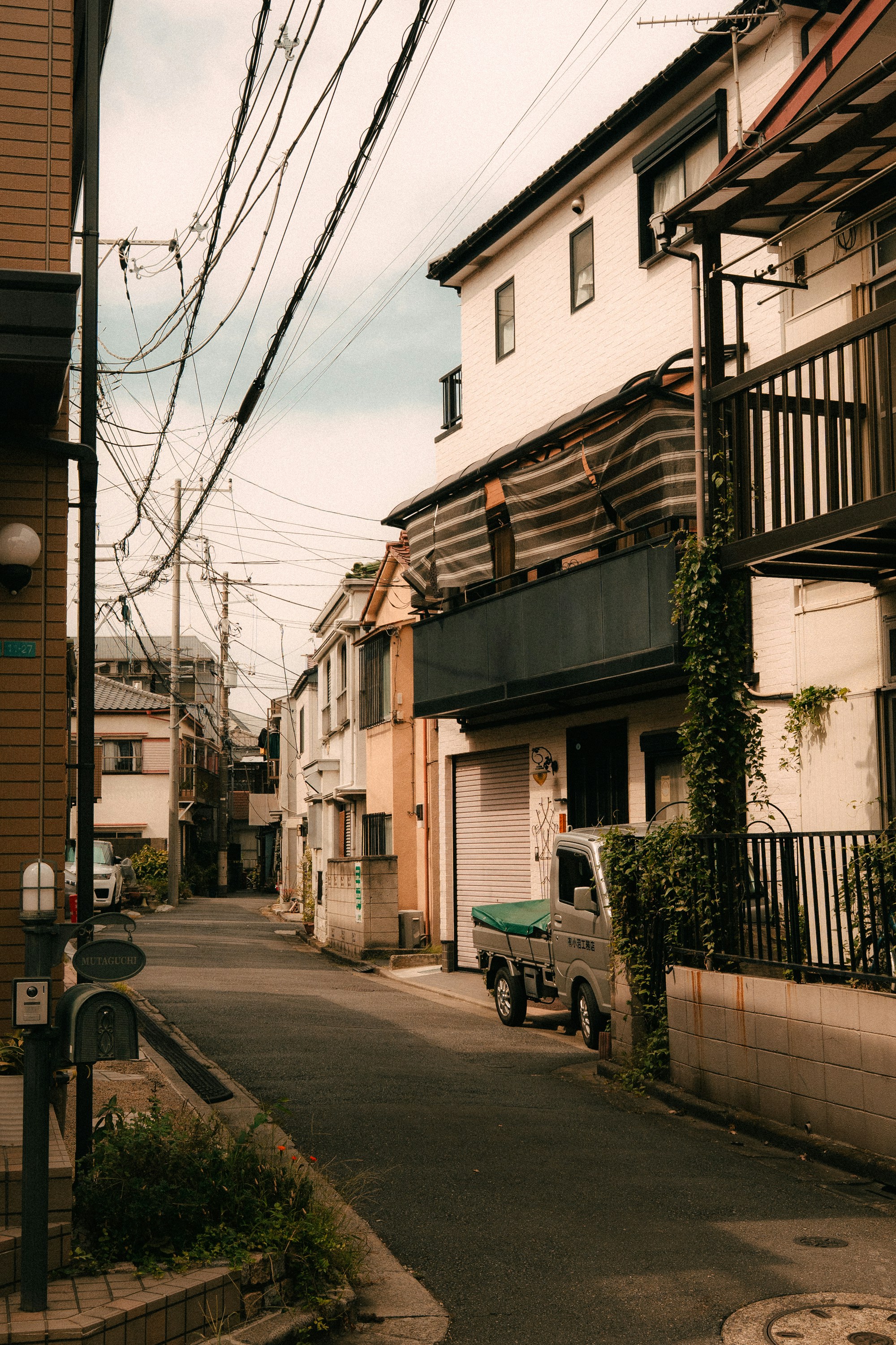 Quiet Japanese Street Between Two-Story Facades