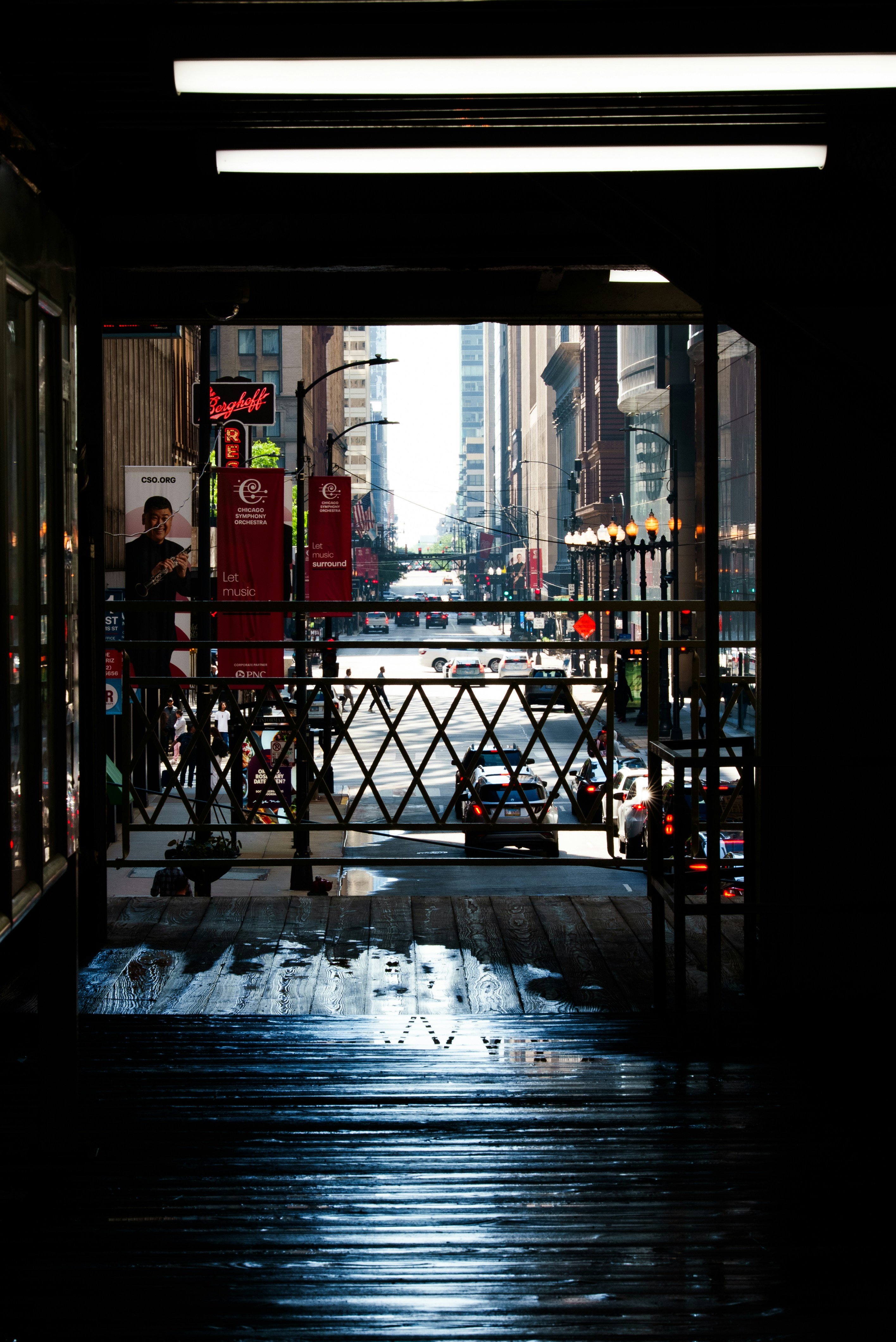 Urban Portal: Evening Street Through a Gated Crossing
