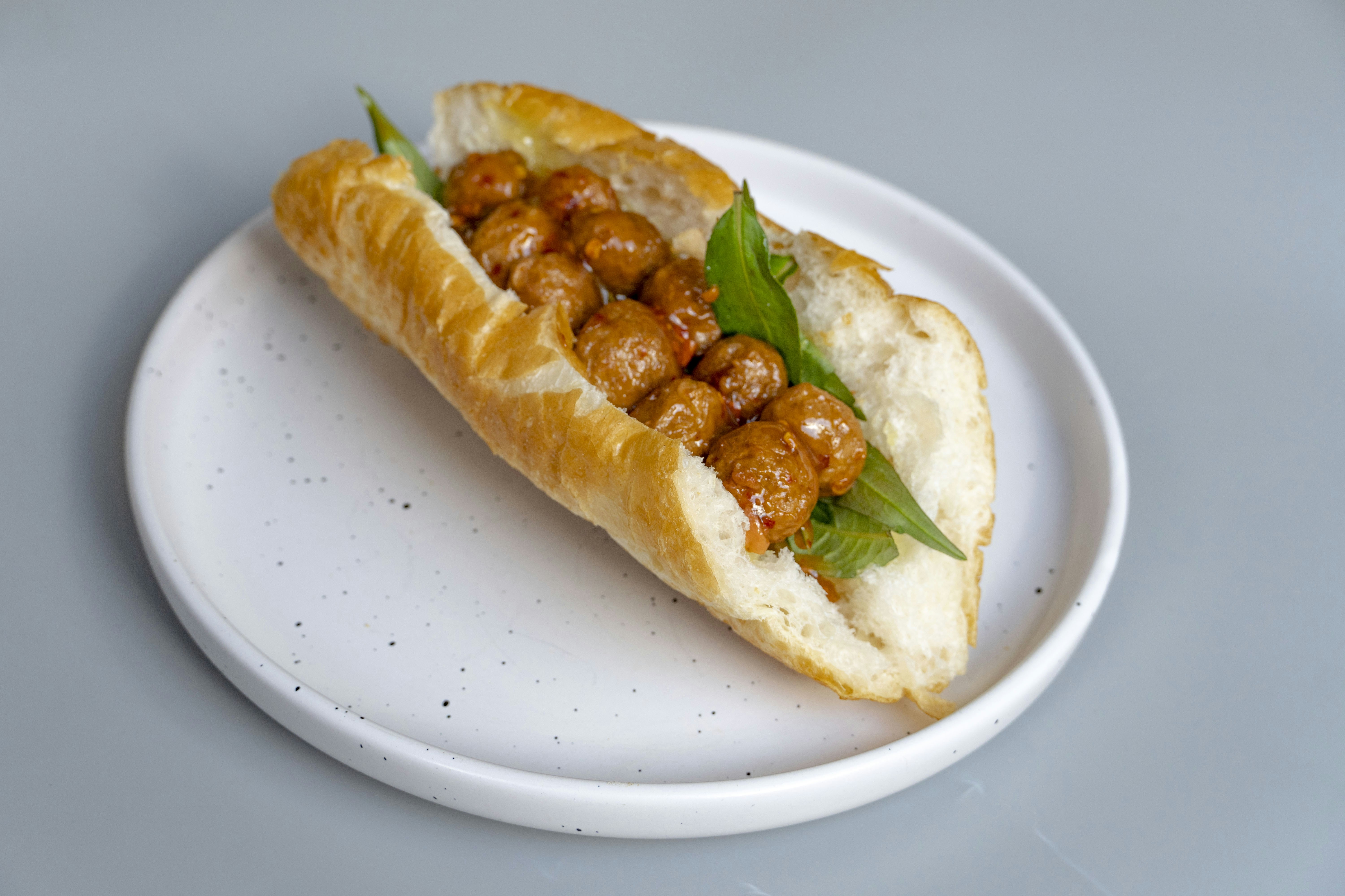 Golden Bockwurst on a Fresh Baguette: A Minimalist Plate