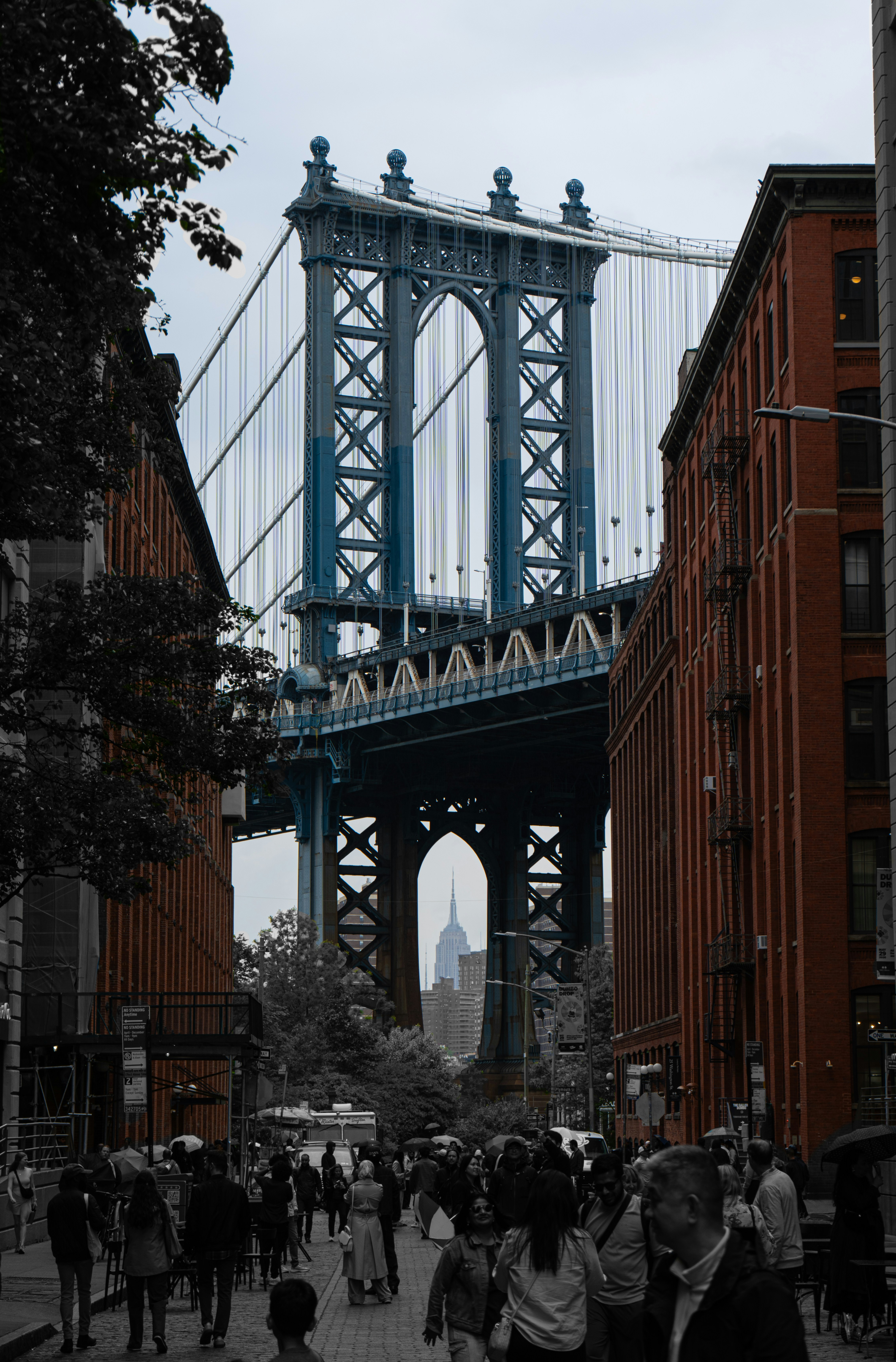 Under the Blue Arches: A Pedestrian Canyon Beneath Manhattan’s Bridge