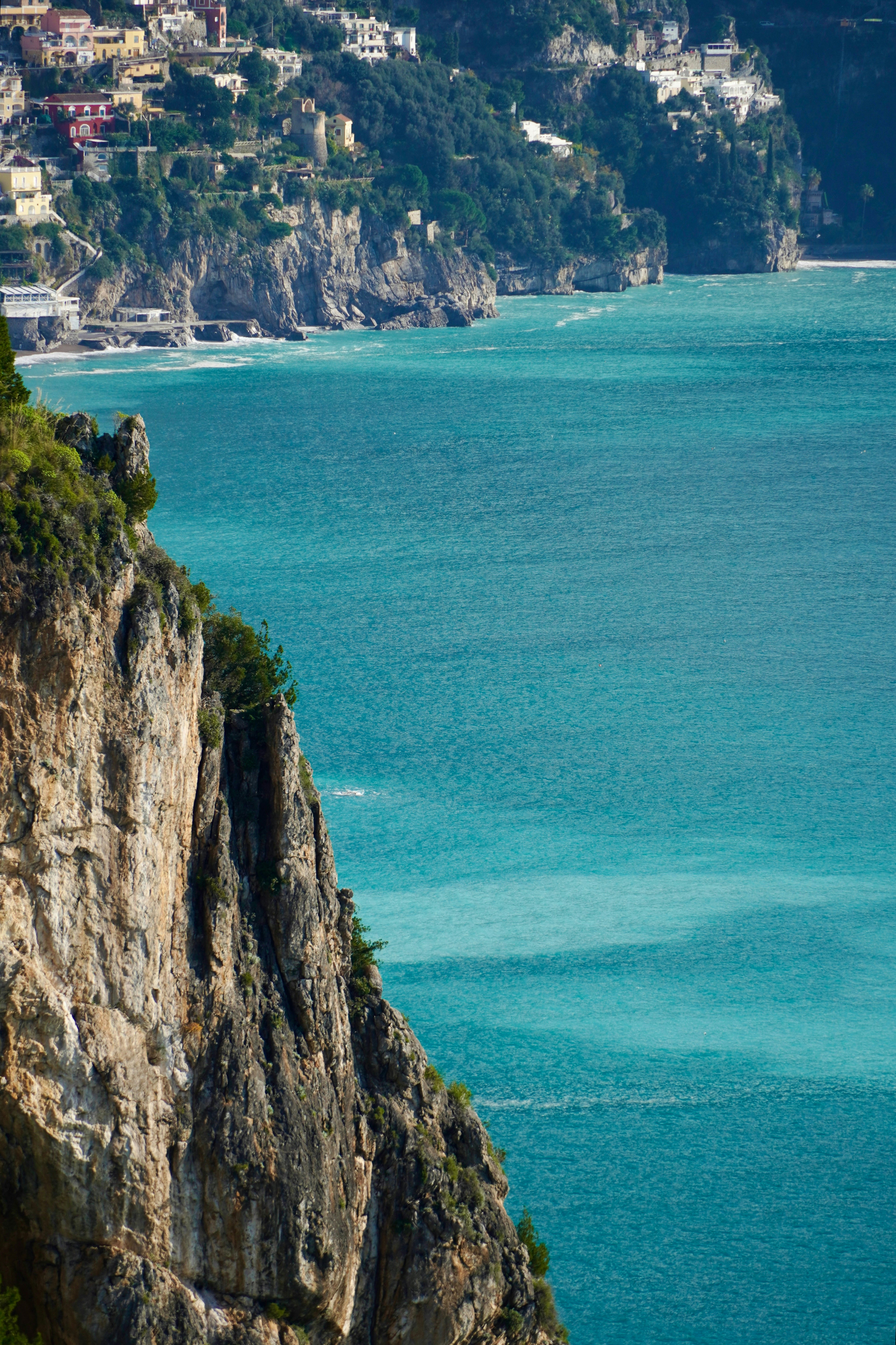 Vertical Cliffside Village Along Turquoise Riviera