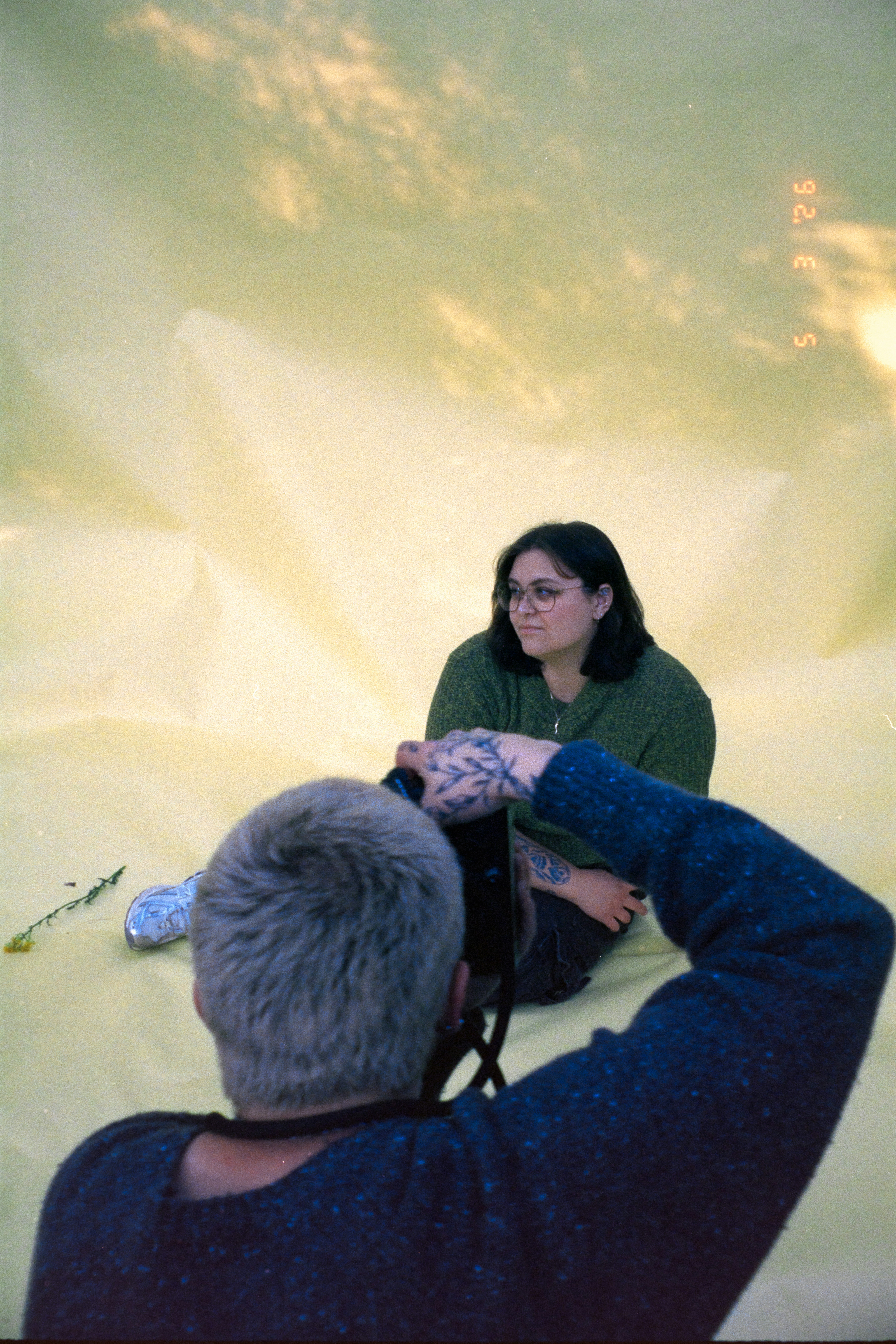 Portrait in a Soft Field: A Quiet Interview Moment on Yellow Backdrop