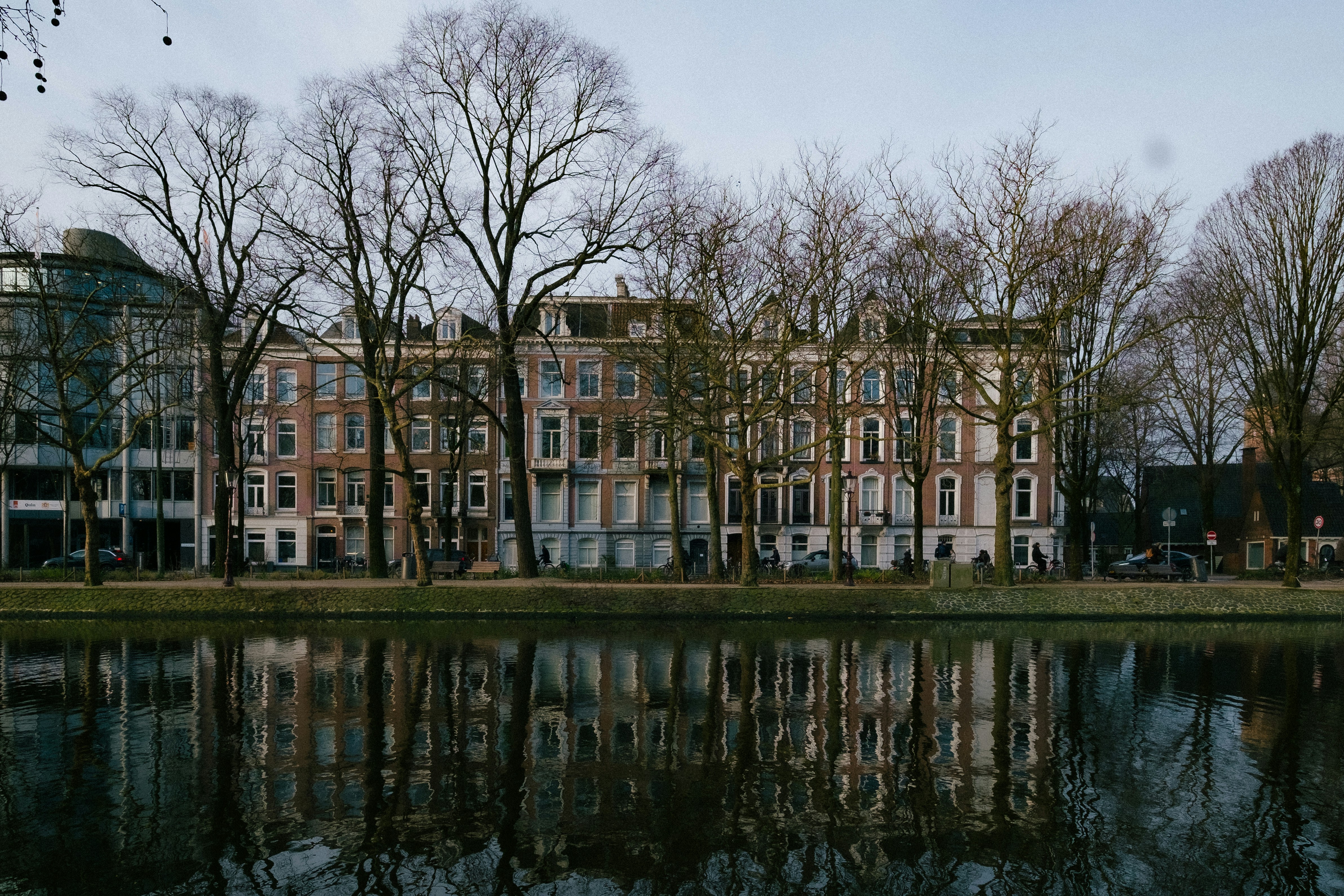 Row of Townhouses Reflected: Quiet riverside in Winter Light