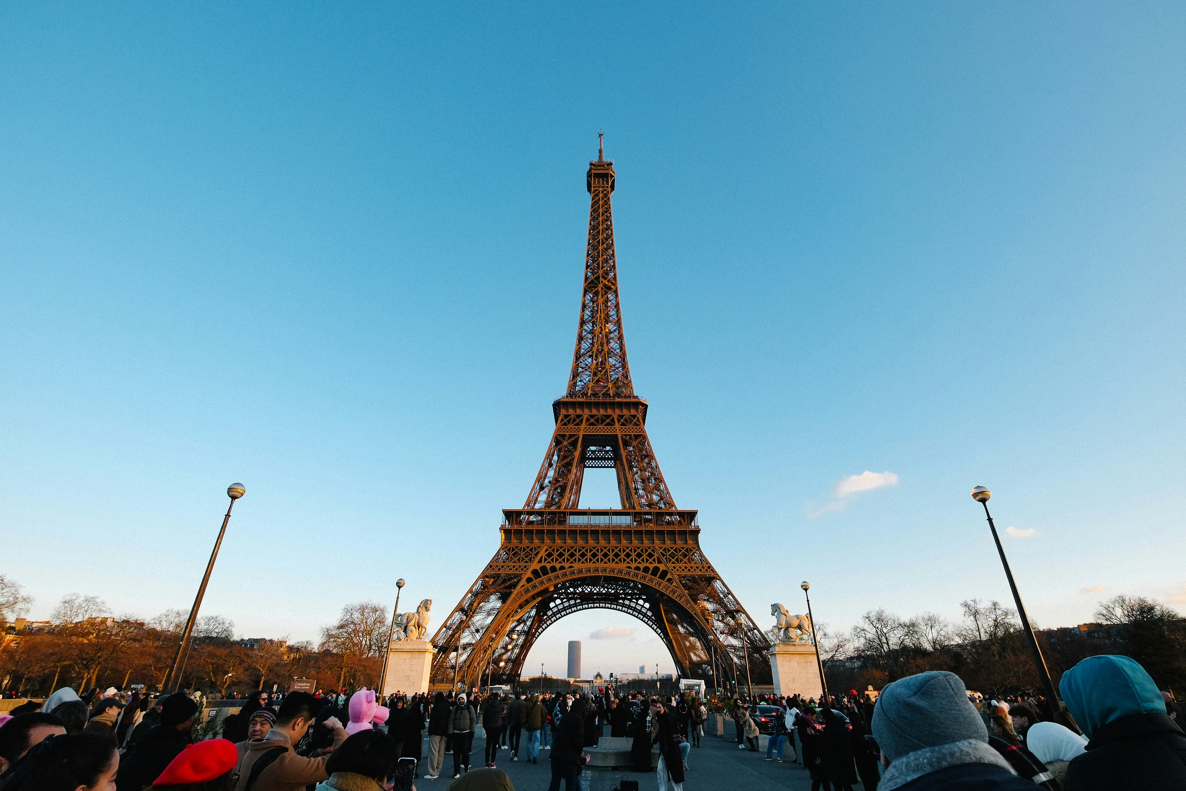 Towering Icon: Sunset Crowd at the Eiffel