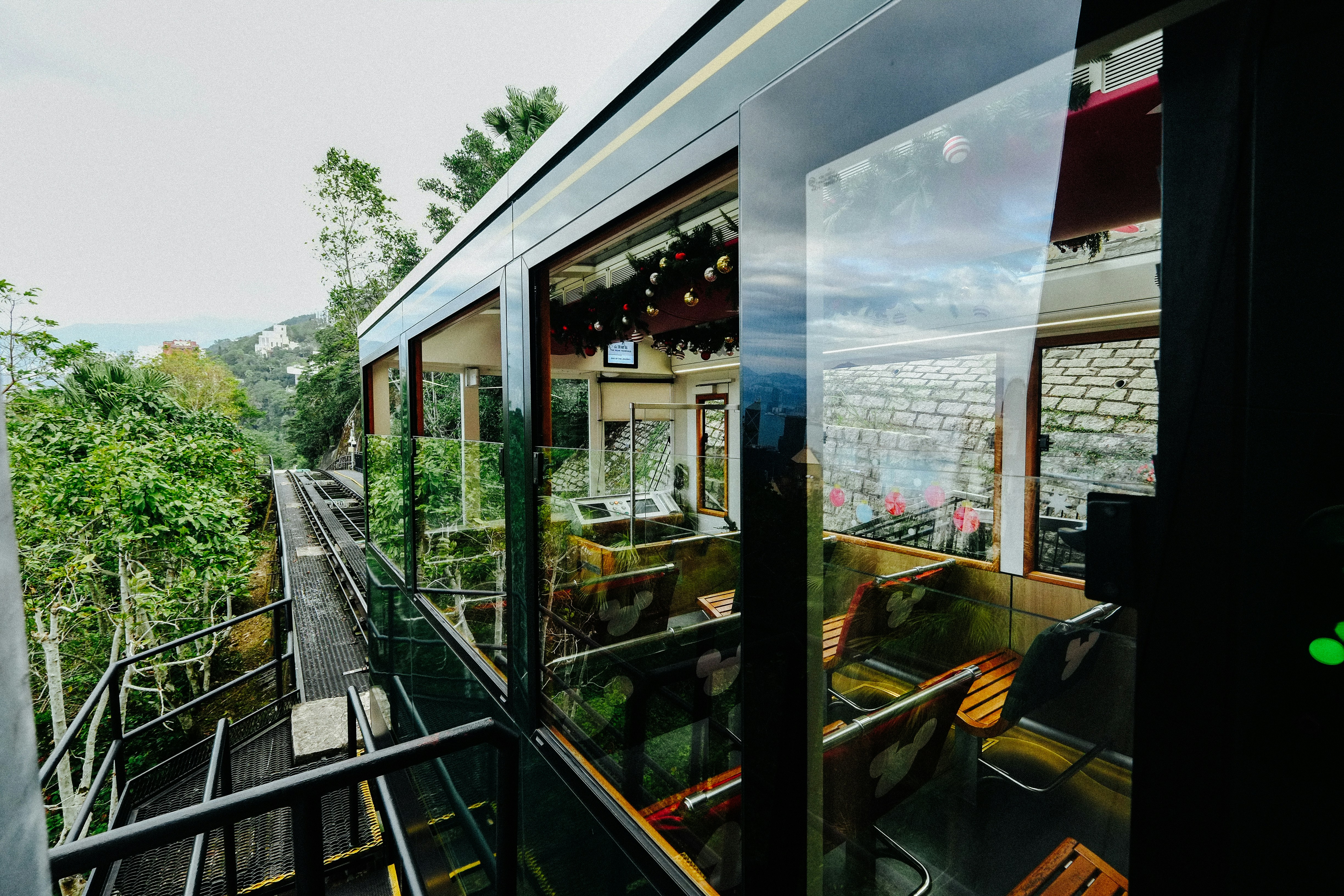 Glass-encased Train Caropulence Overlooking Verdant Vale