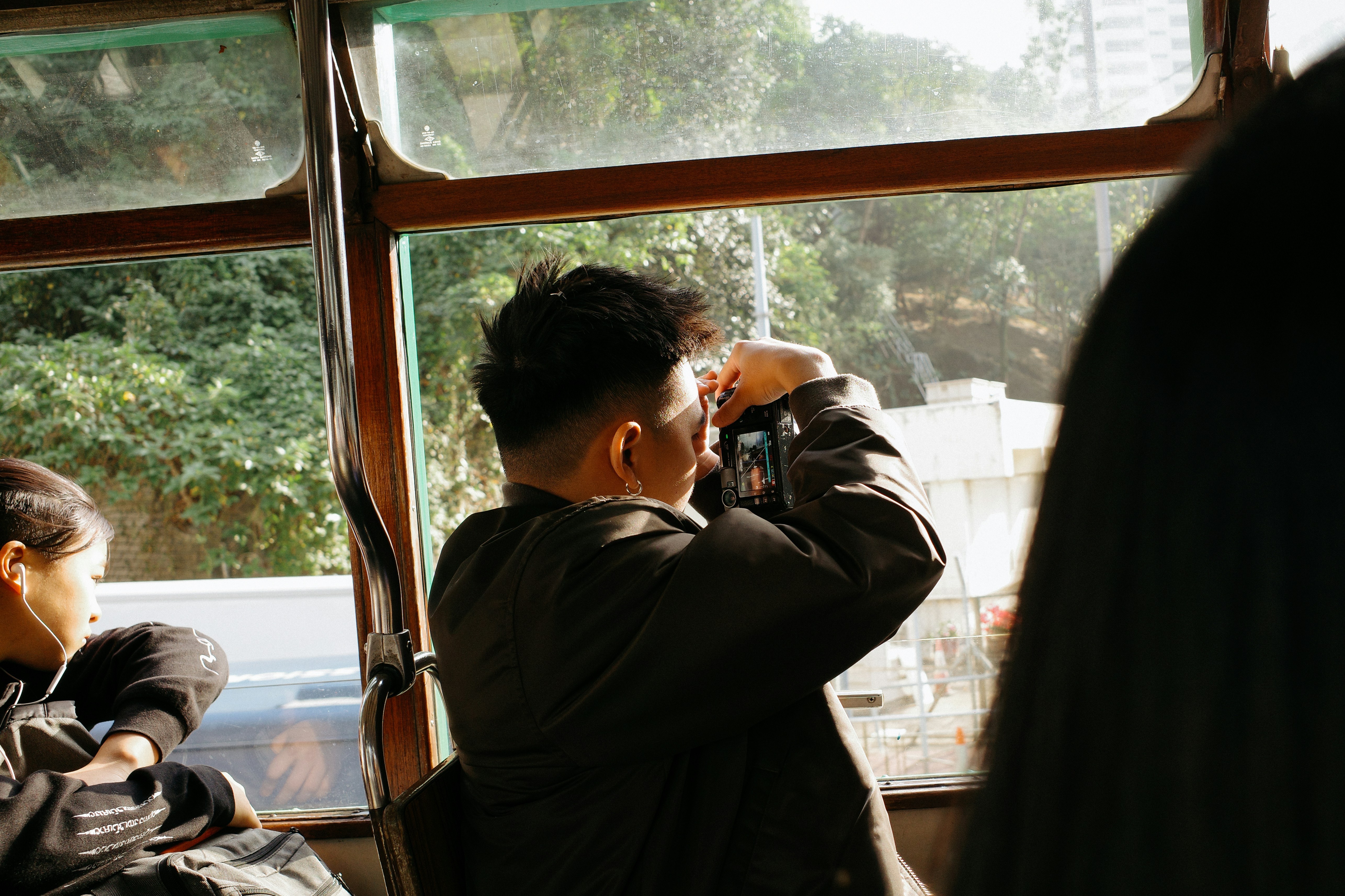Bus Window Photography: The Portraitist Capturing a Moment Inside a Moving Frame
