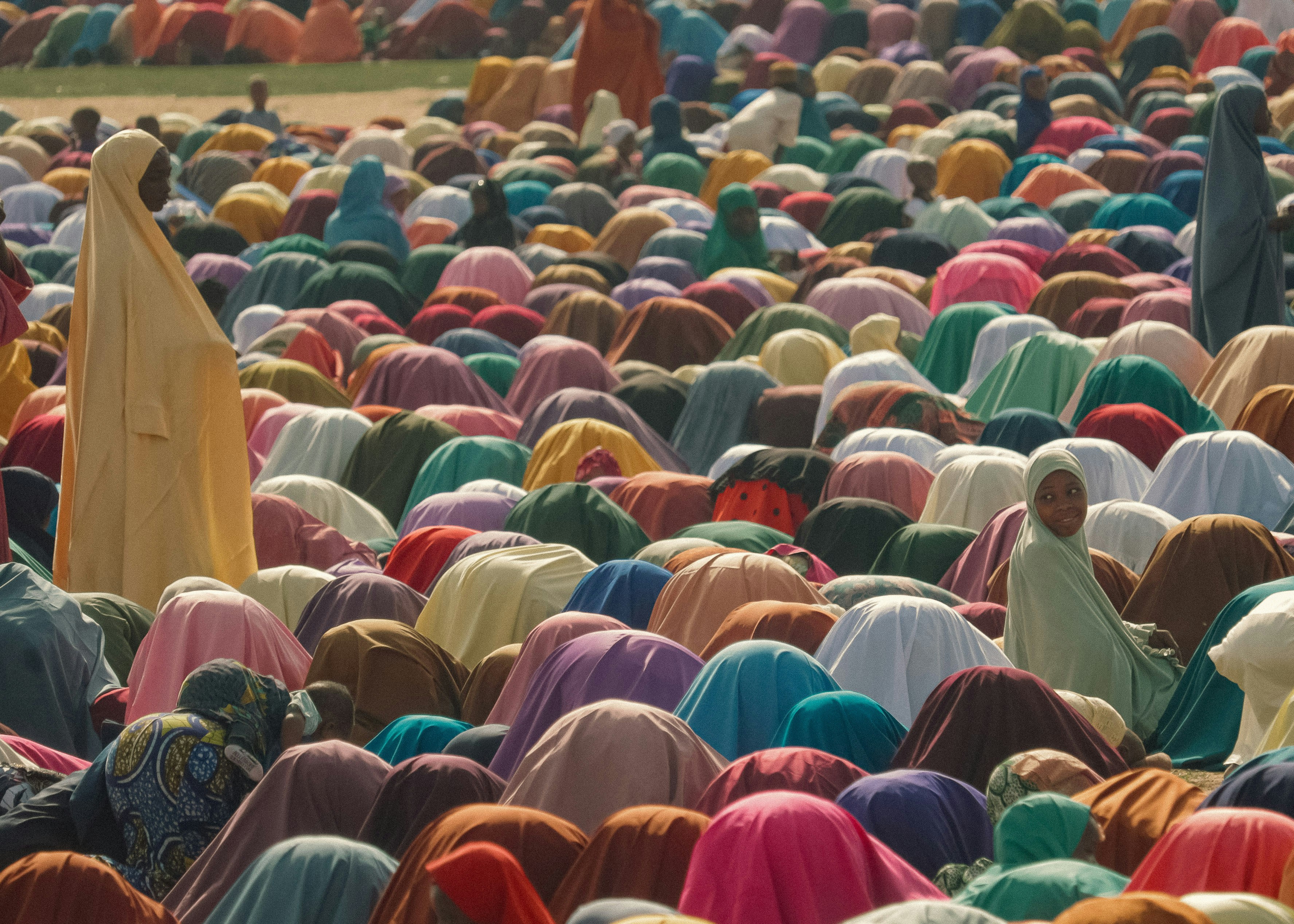Sea of Veiled Figures: A Silent Mosaic in Color