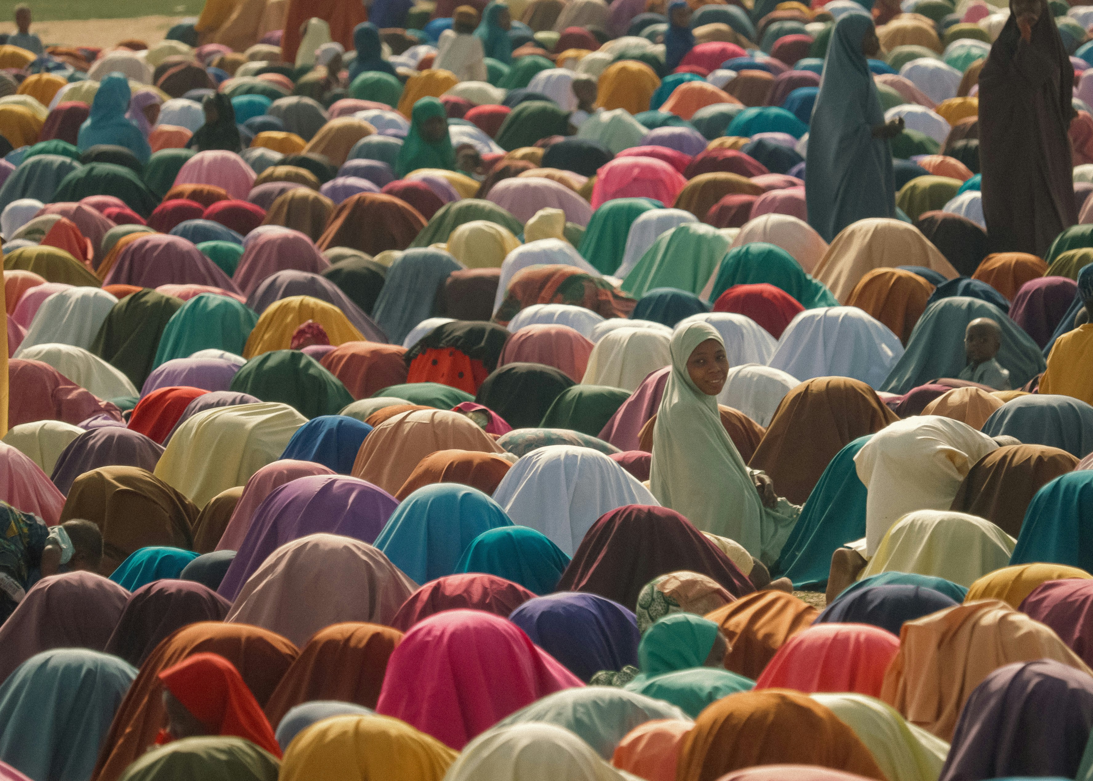 A Sea of Colorful Hoods: Quiet Unity in a Packing Crowd