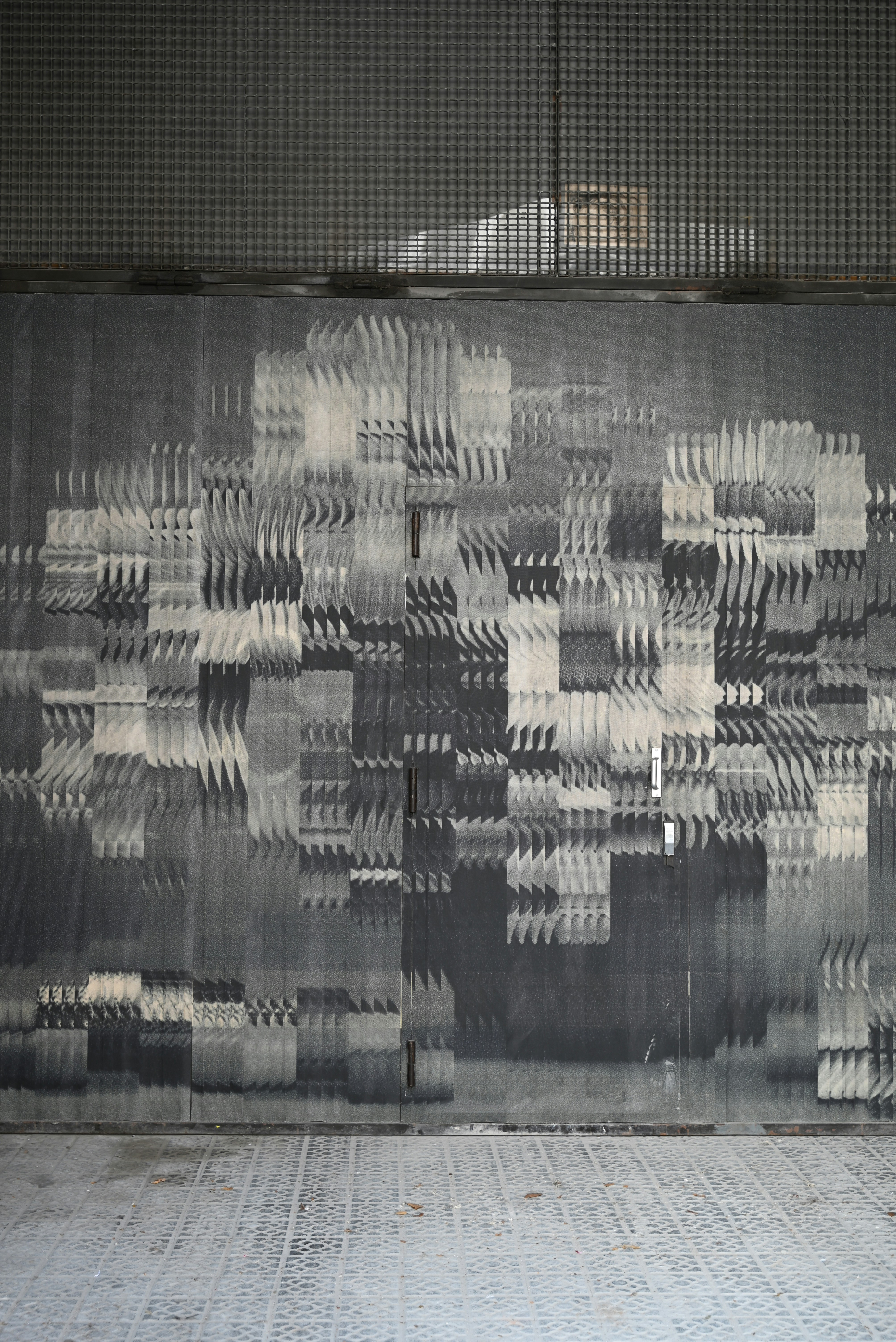 Rhythms of Steel: Refracted Squares on a Dim Facade
