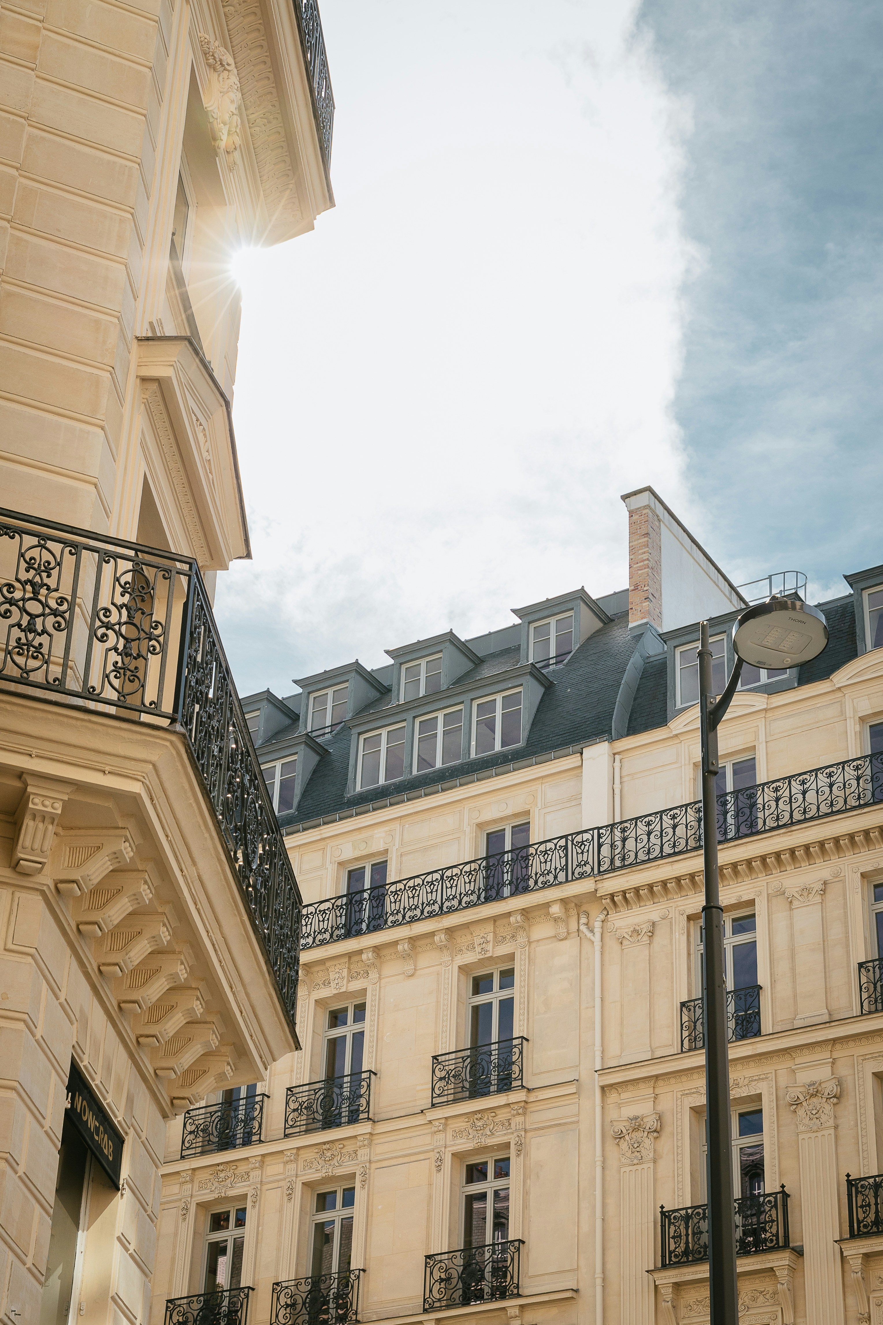 Sunlit Facade Reverie: Parisian Architecture and Blue Sky