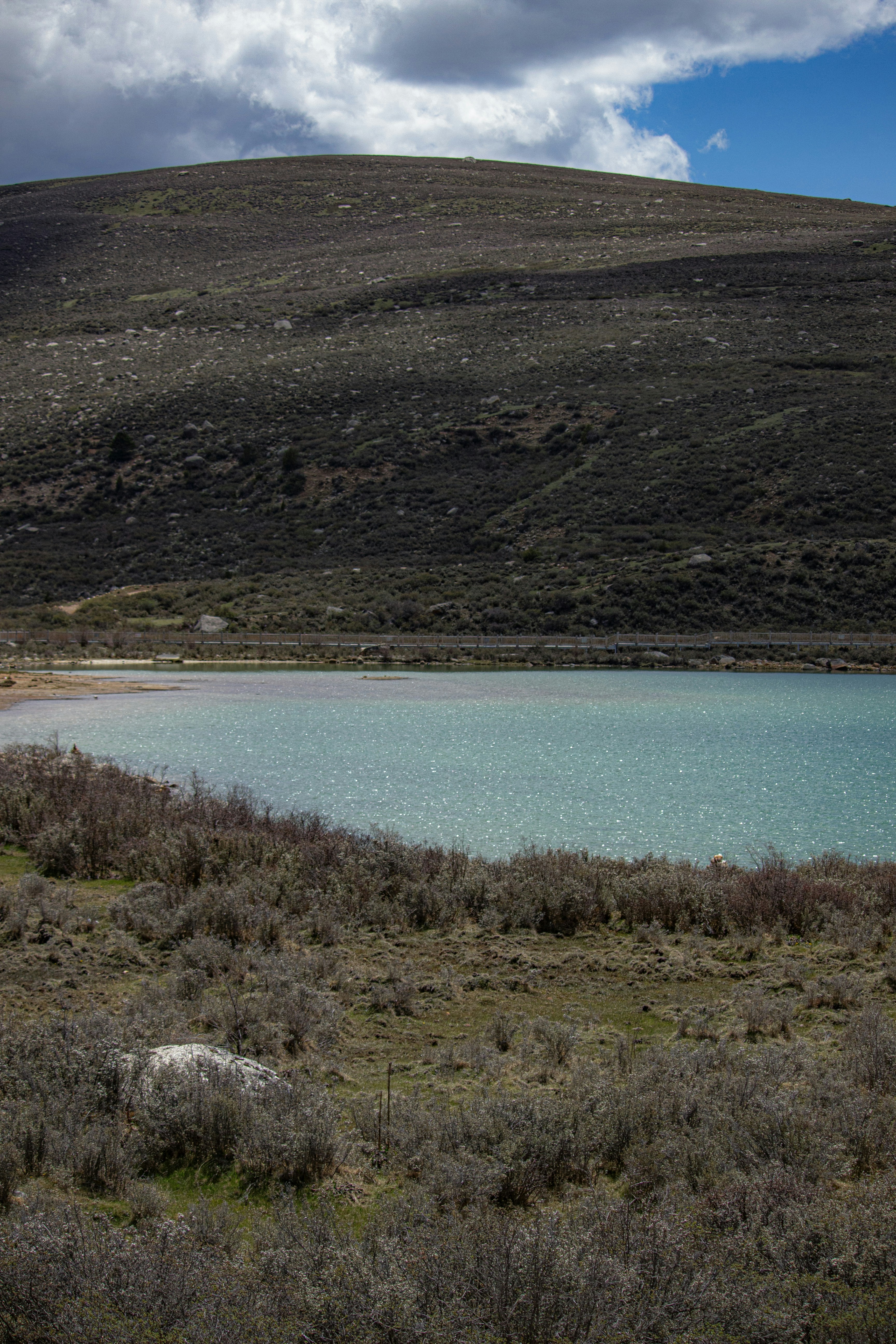 Turquoise Lake at the Foot of a Myriad Hills