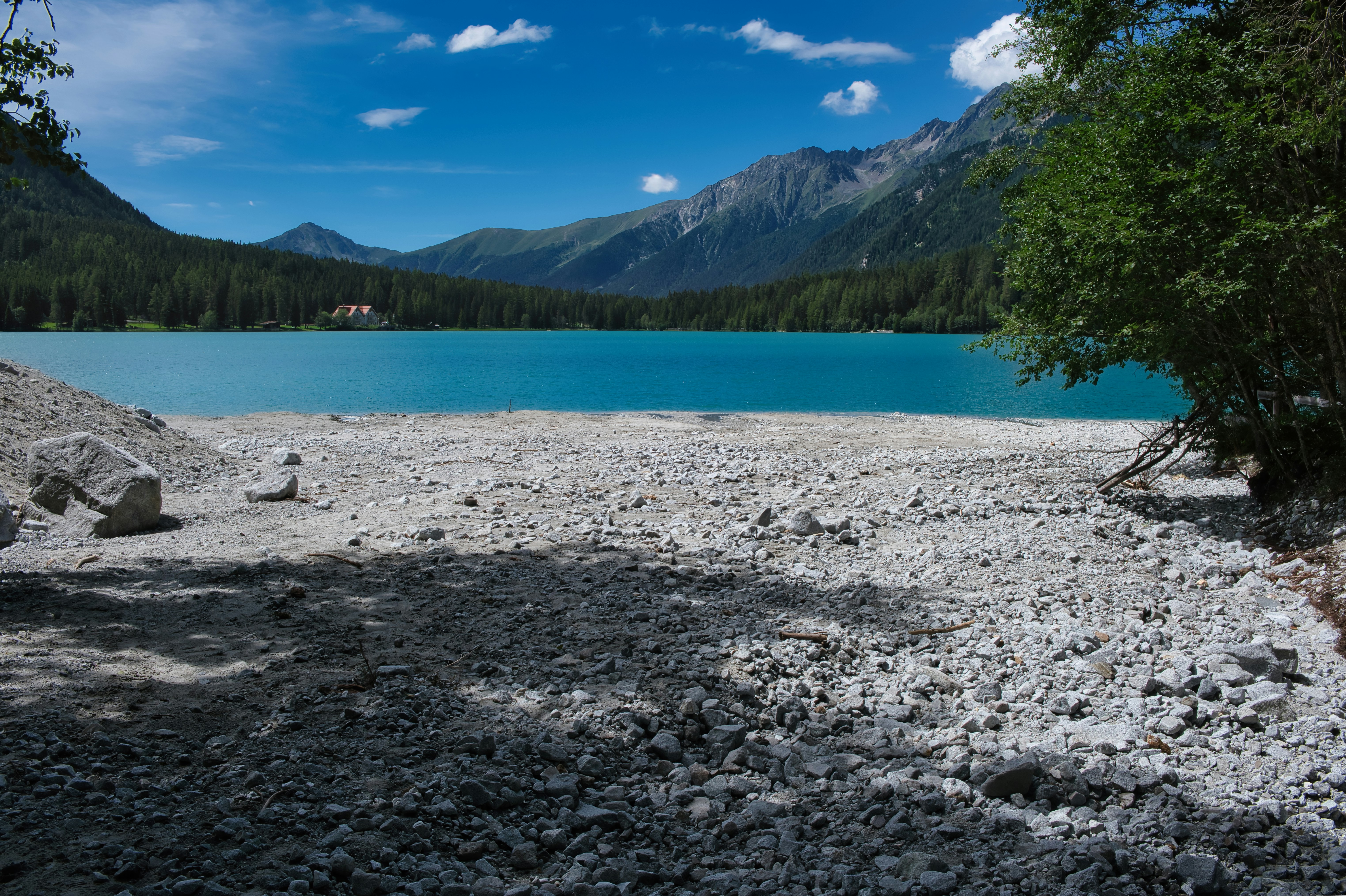 Azure Mirror: A Pebble Beach by the Mountain Lake