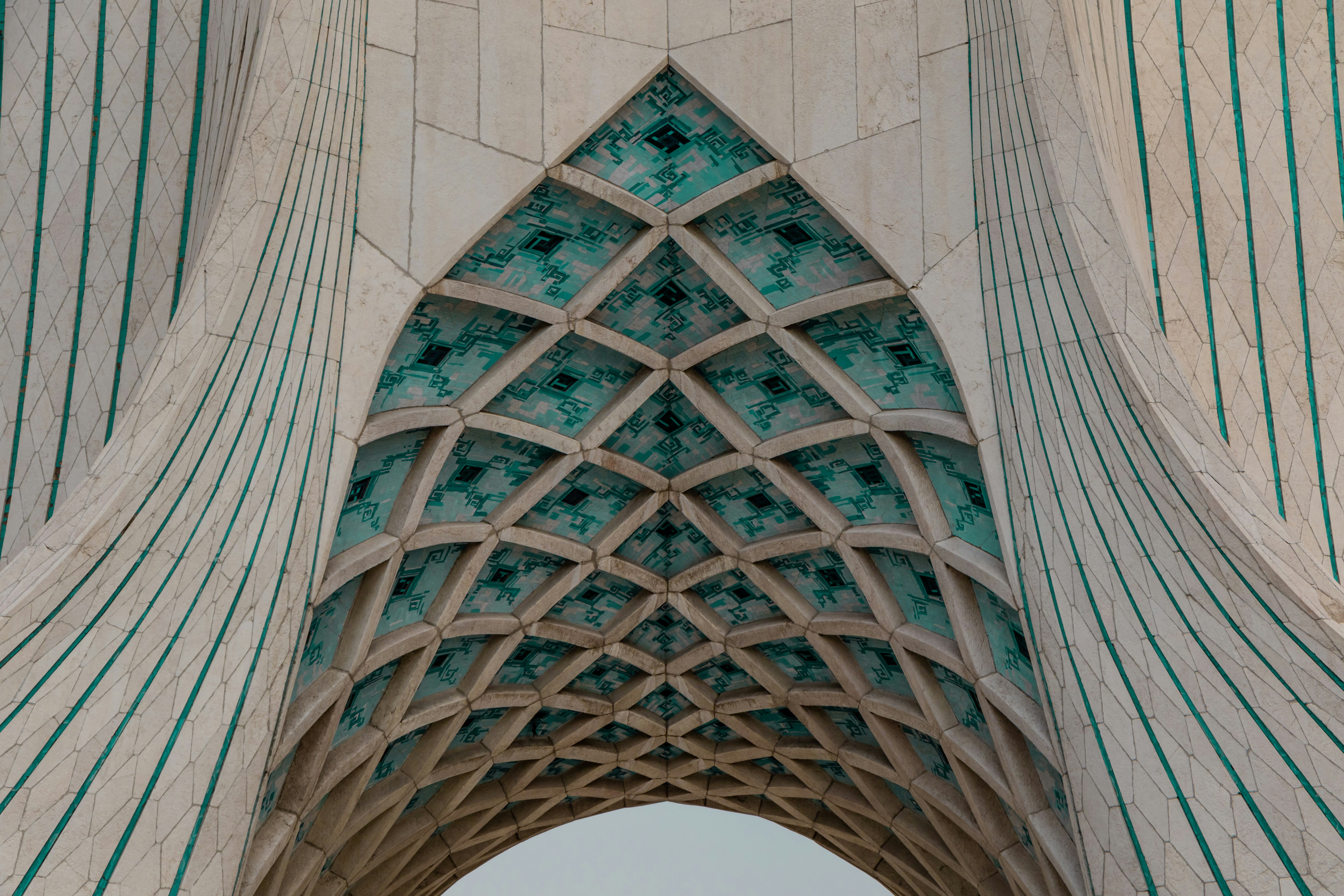 Geometric Vault: Parabolic Arcade Framed by Towering Lattice