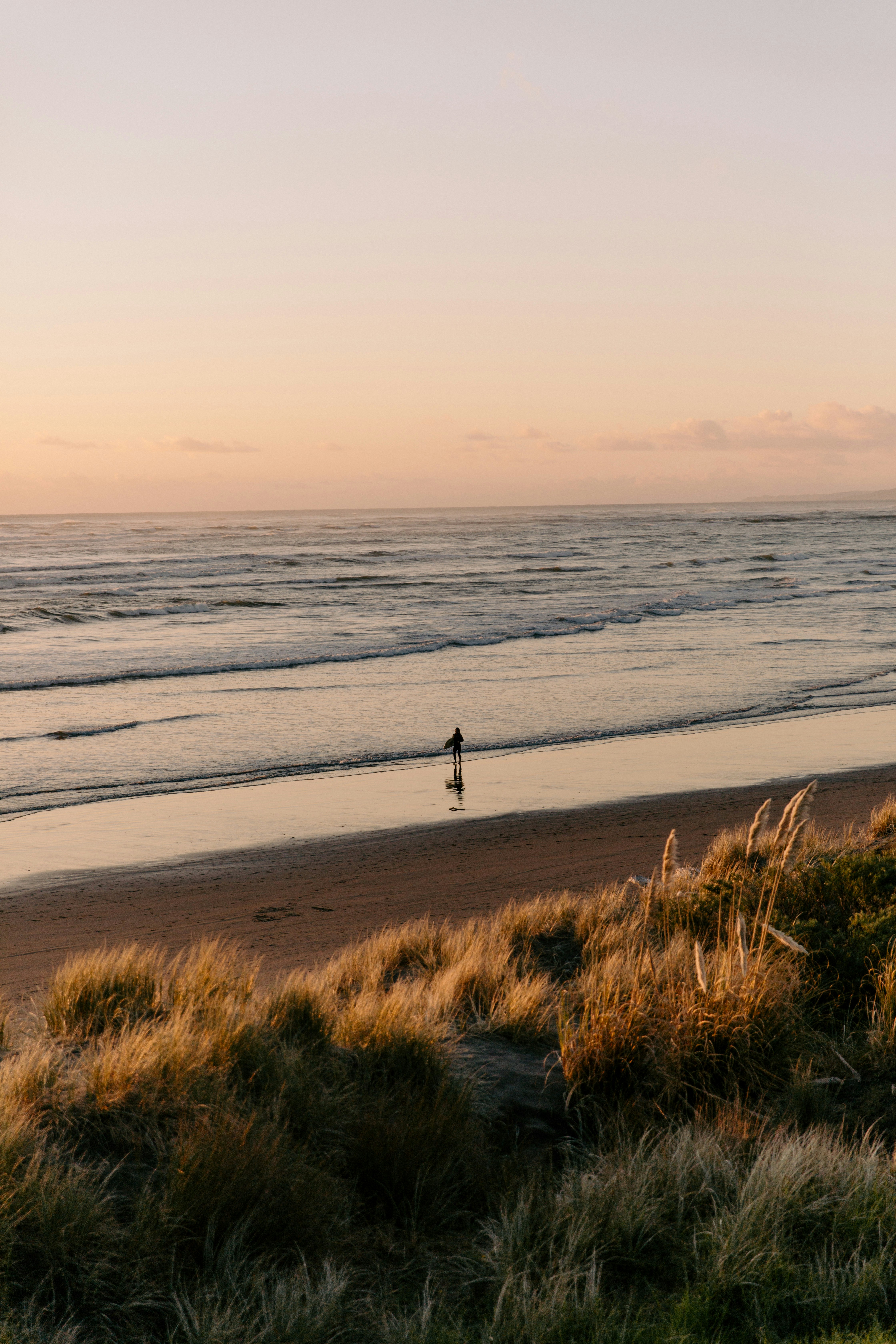 Solitary Surfer at Sunset Churching the Tides