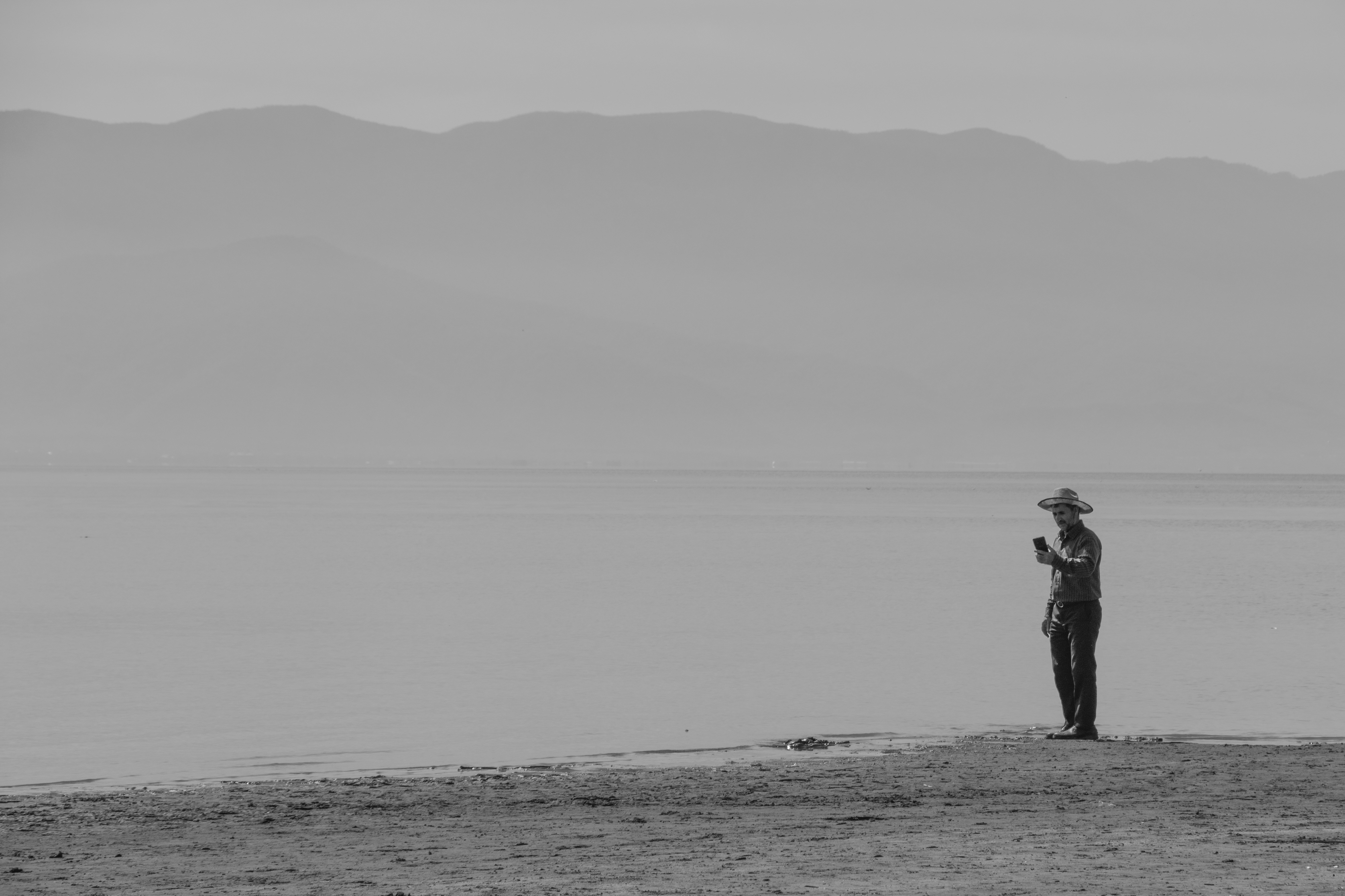 Lonely Angler at the Edge of Silence