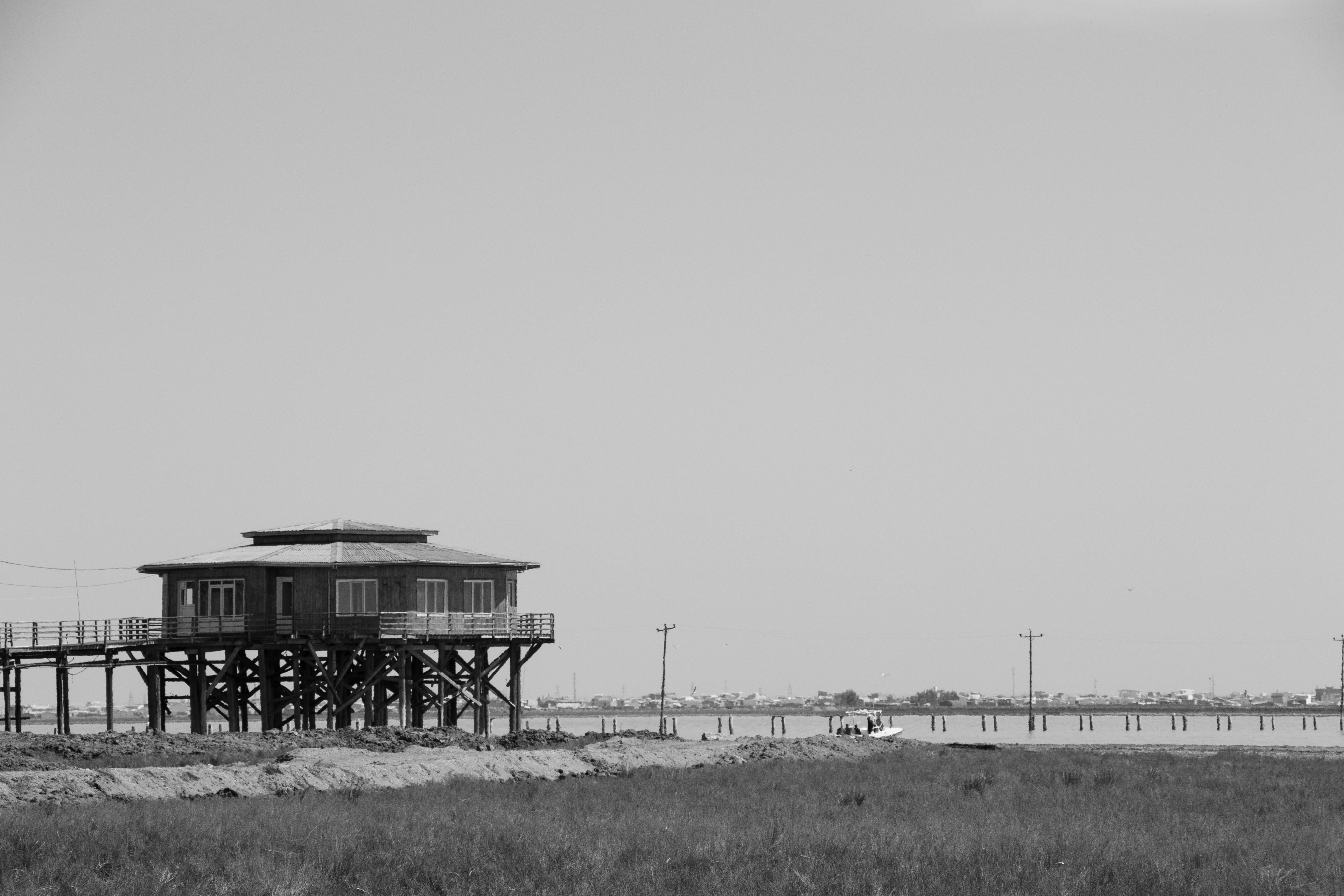 Lifeboat House on stilts at a quiet shoreline