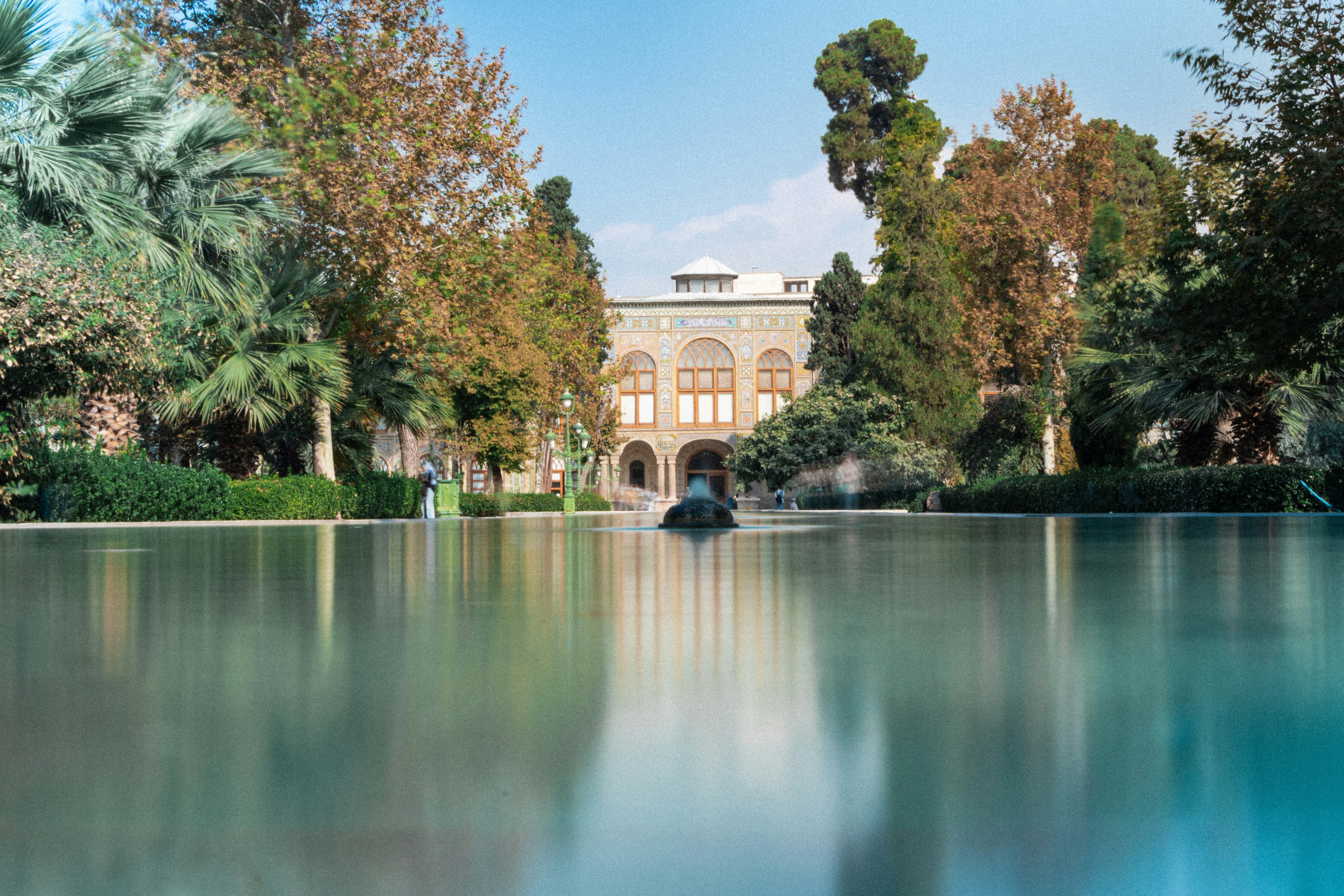 Symmetric Campus Vista: Central Fountain Framed by Grounds and Archway